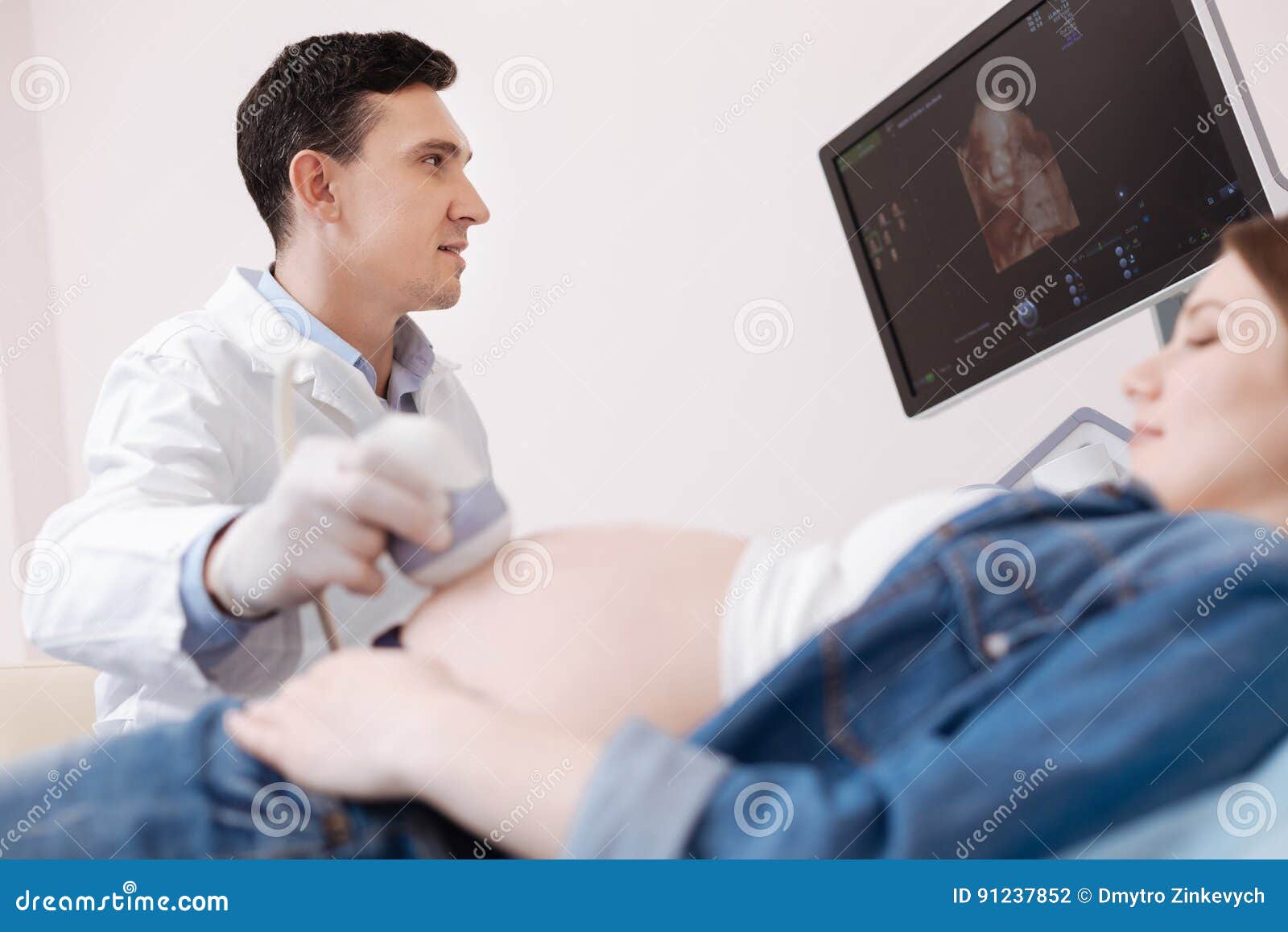 Involved Young Gynecologist Using Equipment for Sonogram at Work Stock ...