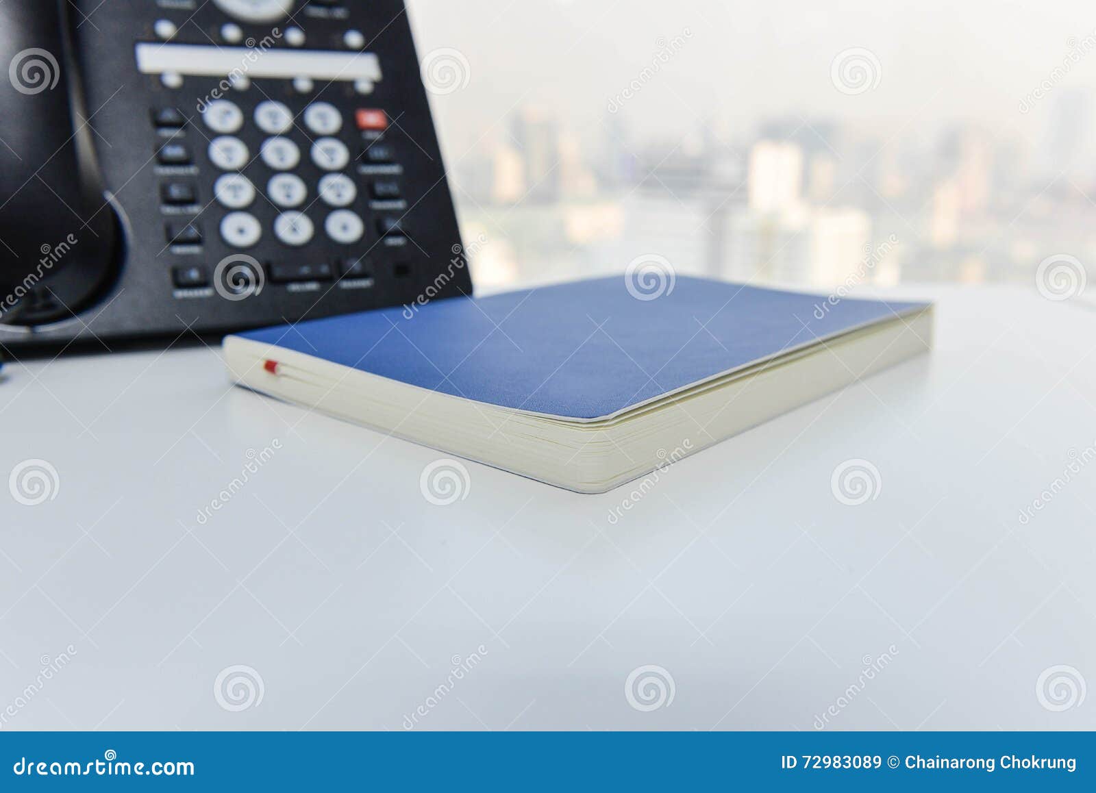 IP Phone and Blue Notebook on the White Table Stock Image - Image of ...