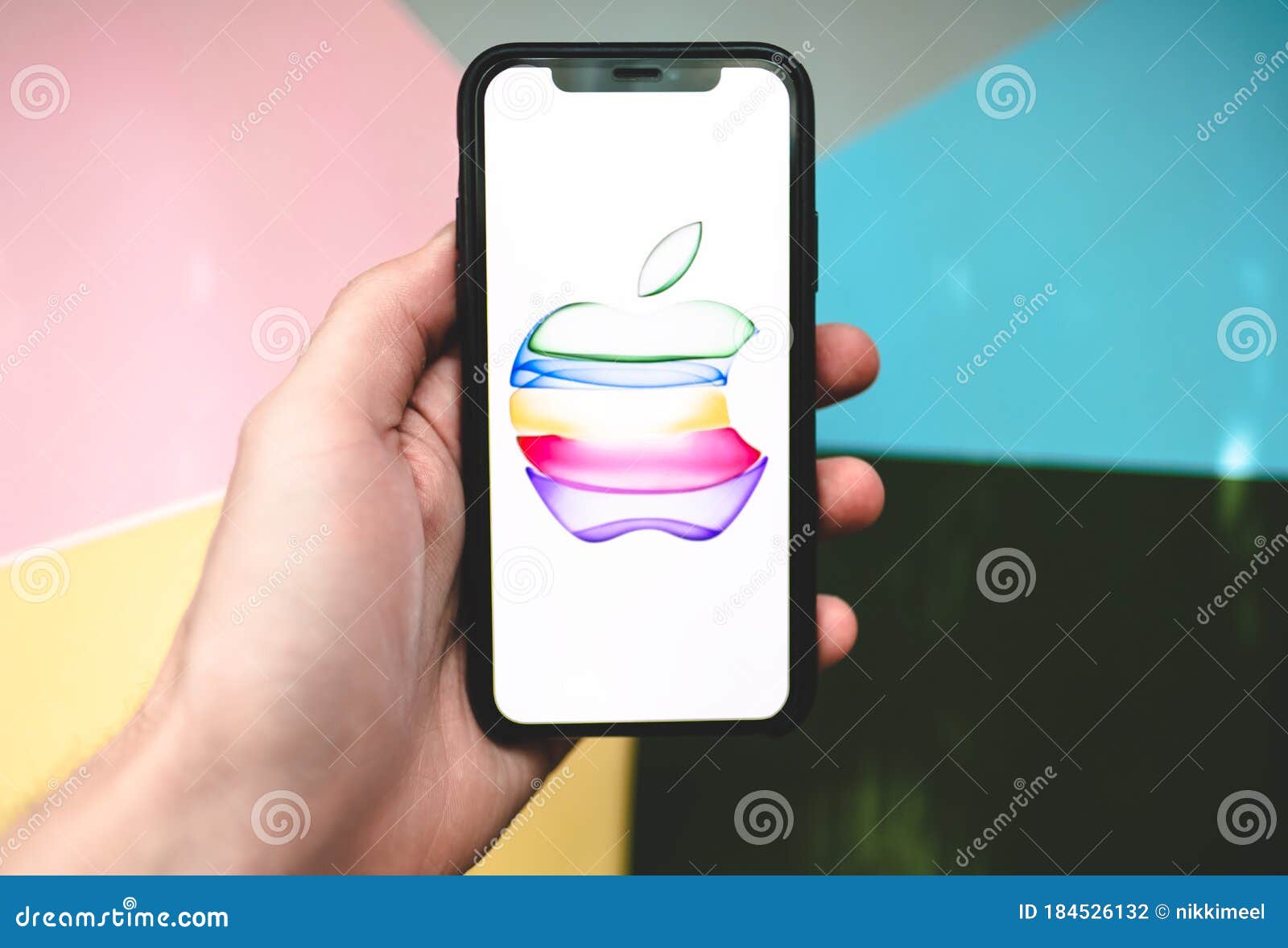 Hand Holding IPhone X with Apple Special Event Logo 2019 on the Screen ...