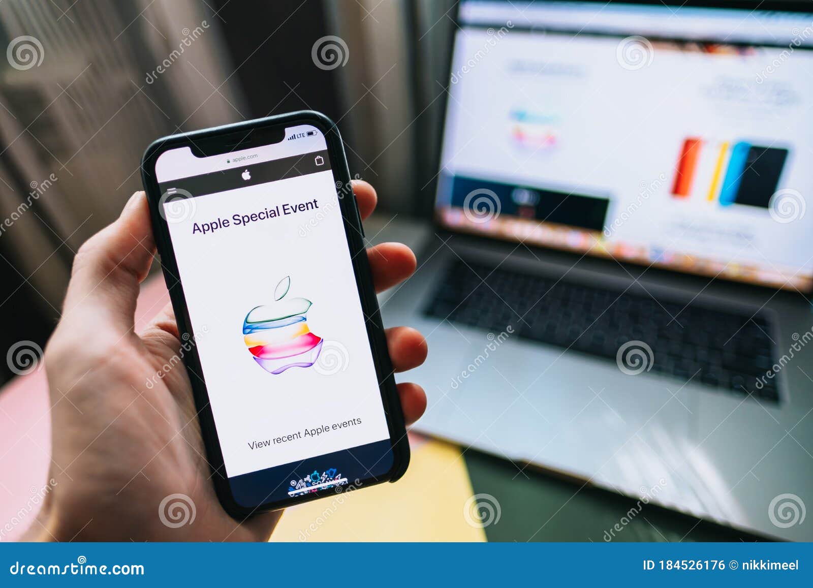 Hand Holding IPhone X with Apple Special Event Logo 2019 on the Screen ...