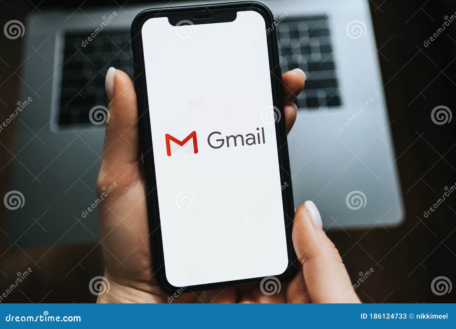 Hand Holding IPhone with Gmail App Logo on the Screen. Editorial Stock ...