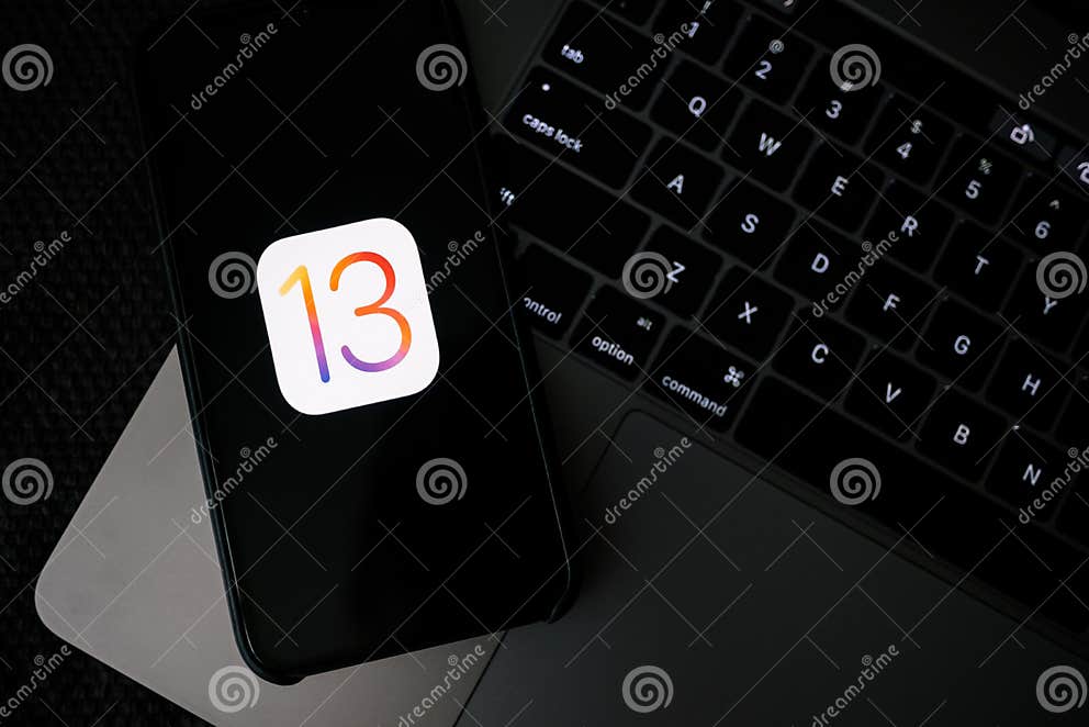 IPhone and MacBook with IOS 13 Logo on the Screen. Editorial Photo ...