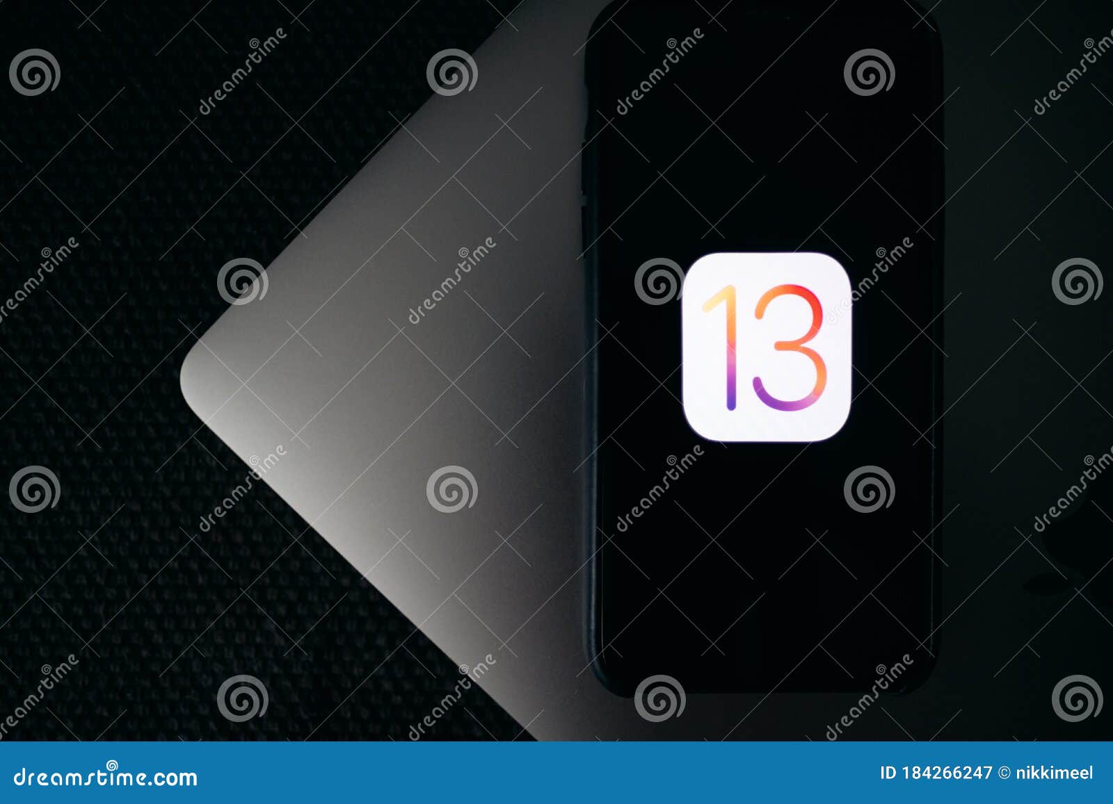IPhone and MacBook with IOS 13 Logo on the Screen. Editorial ...