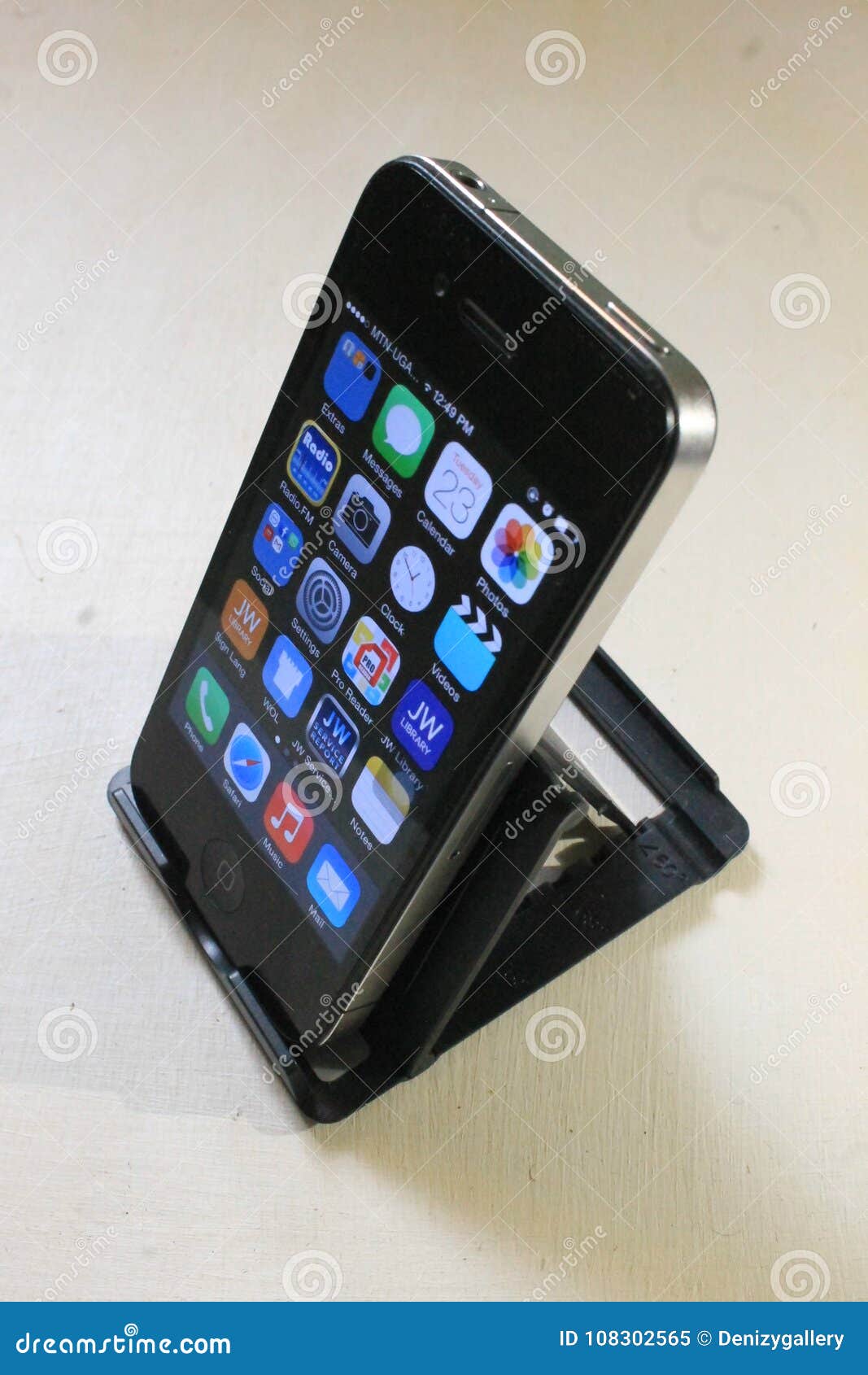 IPhone 4 on a Phone and Tablet Stand Editorial Image - Image of uganda ...