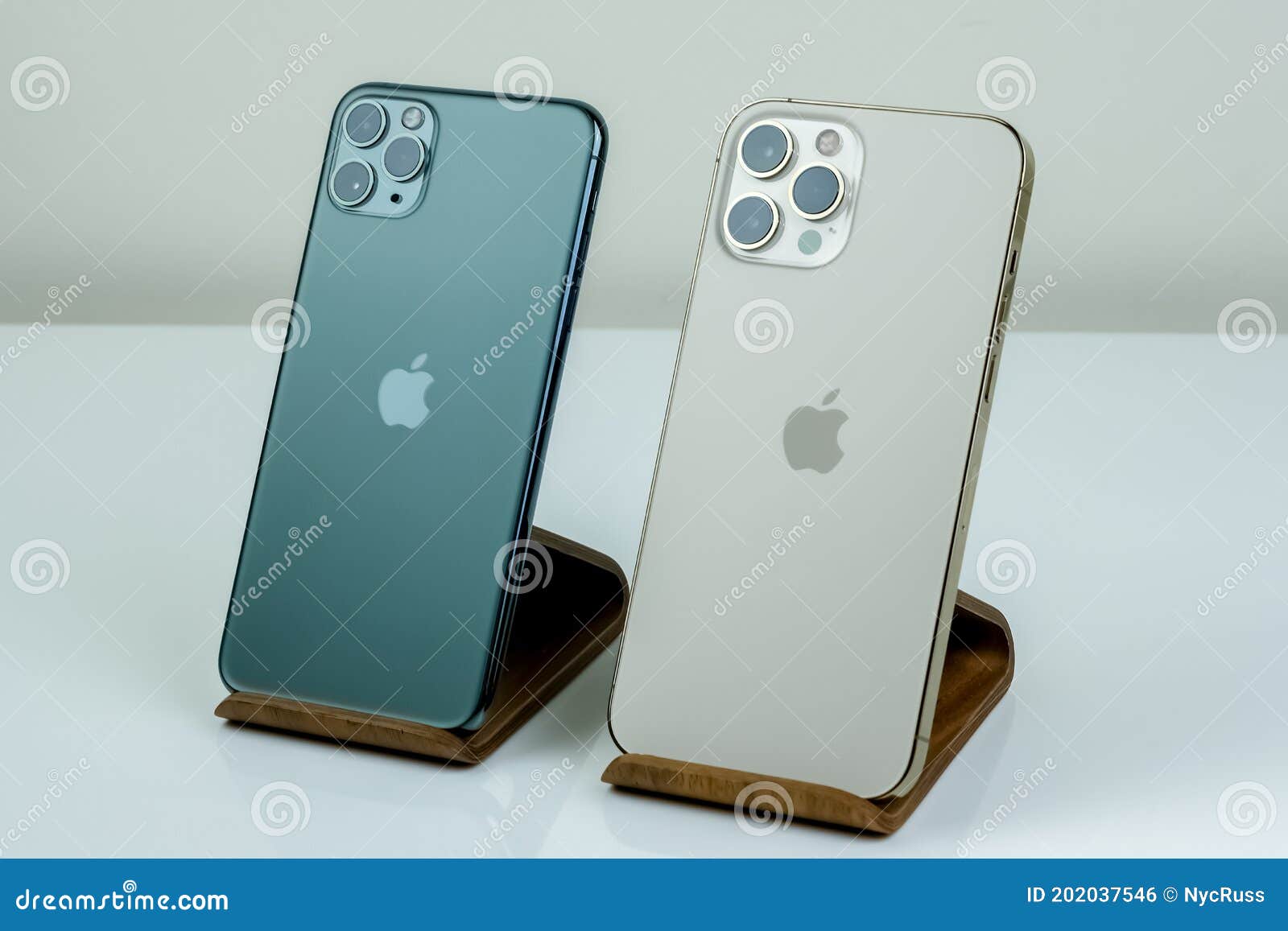 IPhone 12 Pro Max Gold Next To Iphone 11 Pro Max in Green. Editorial ...