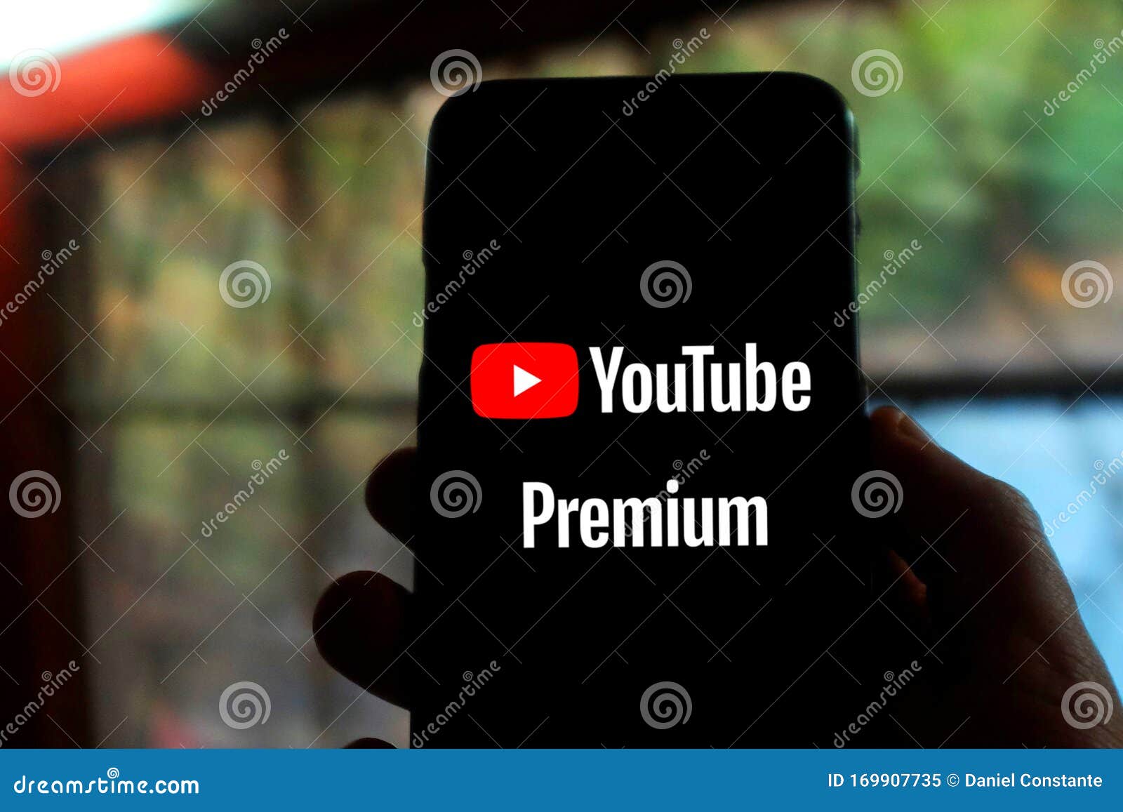 Iphone with the YOUTUBE PREMIUM Logo. YouTube Premium is a Paid ...