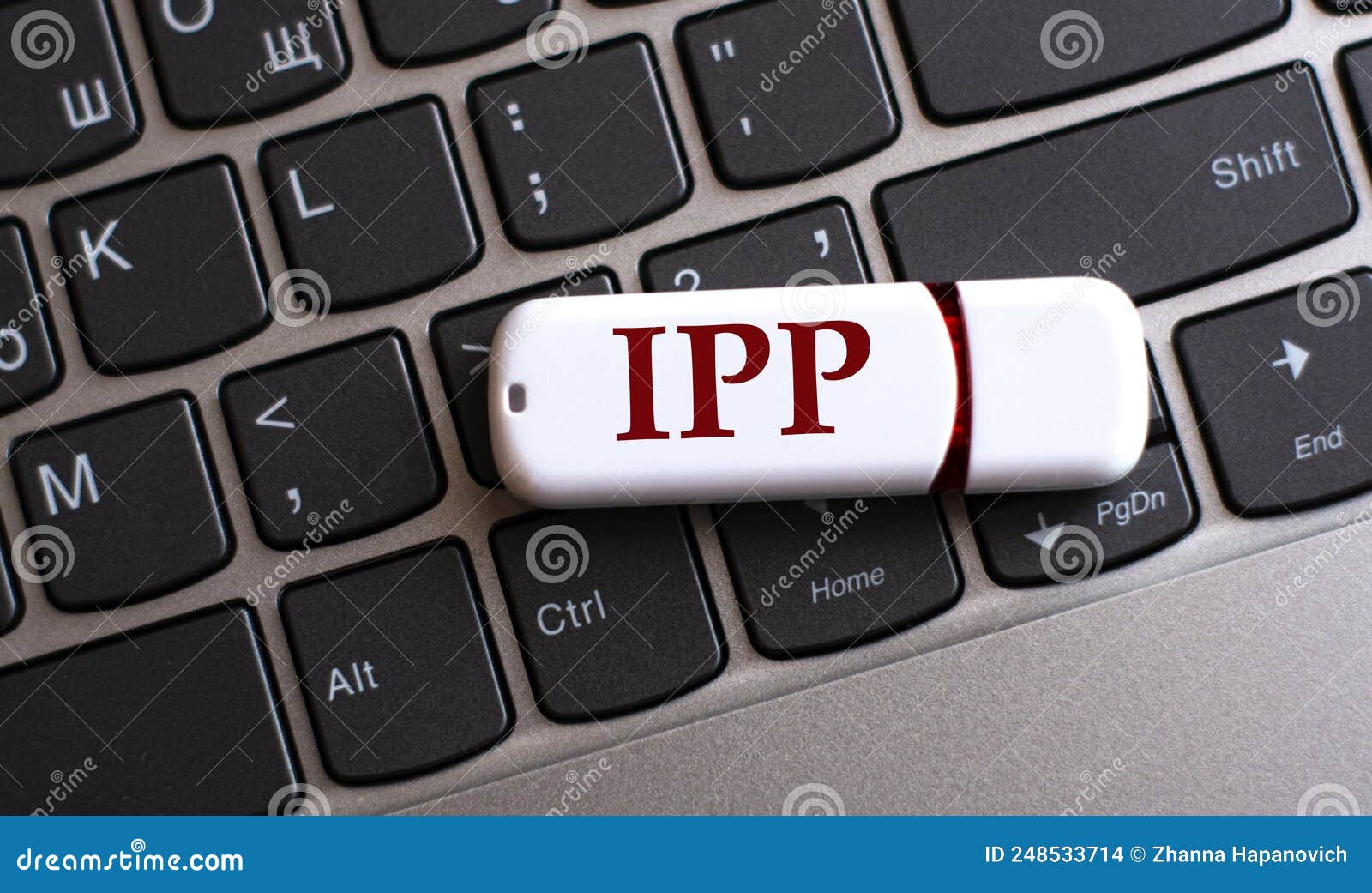 IPP - the Word on a White Flash Drive, Lying on a Black Laptop Keyboard ...