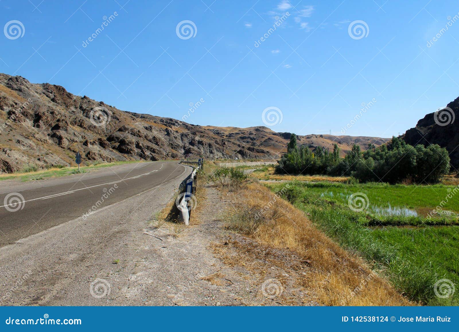 Desert Road in Iran with a Mountain and Rice Field in the Side Stock ...
