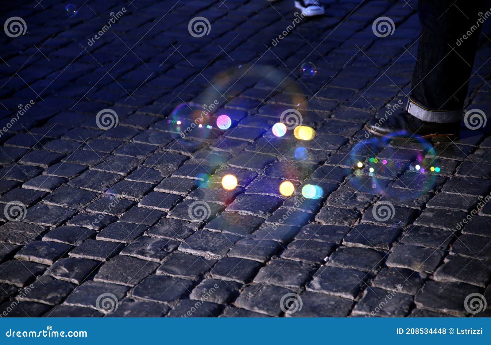 Iridescent Effect of Soap Bubbles, among Feet that Chase Them, with the ...