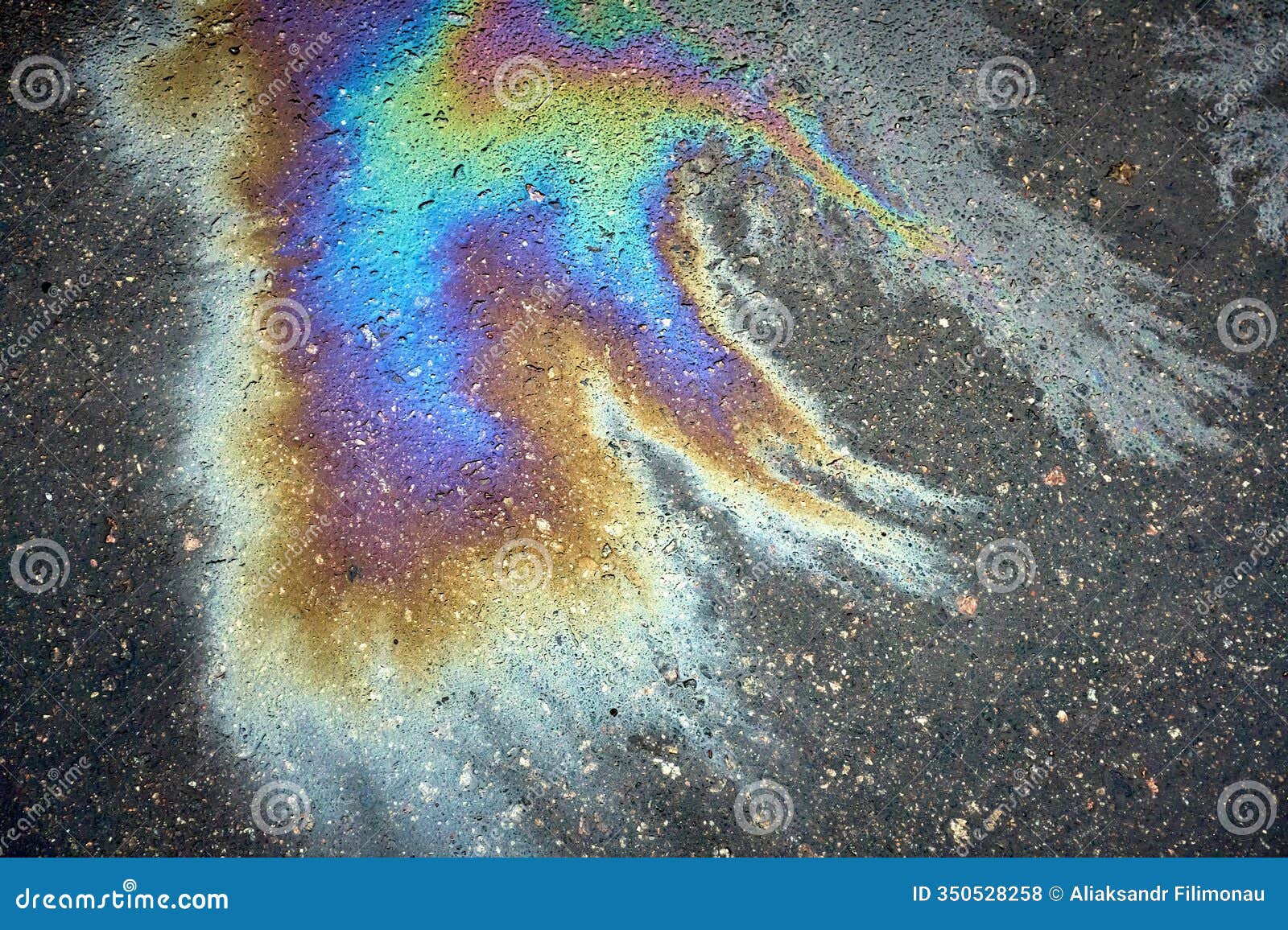 Iridescent Oil Stain Creating a Striking Rainbow Effect on the Wet ...