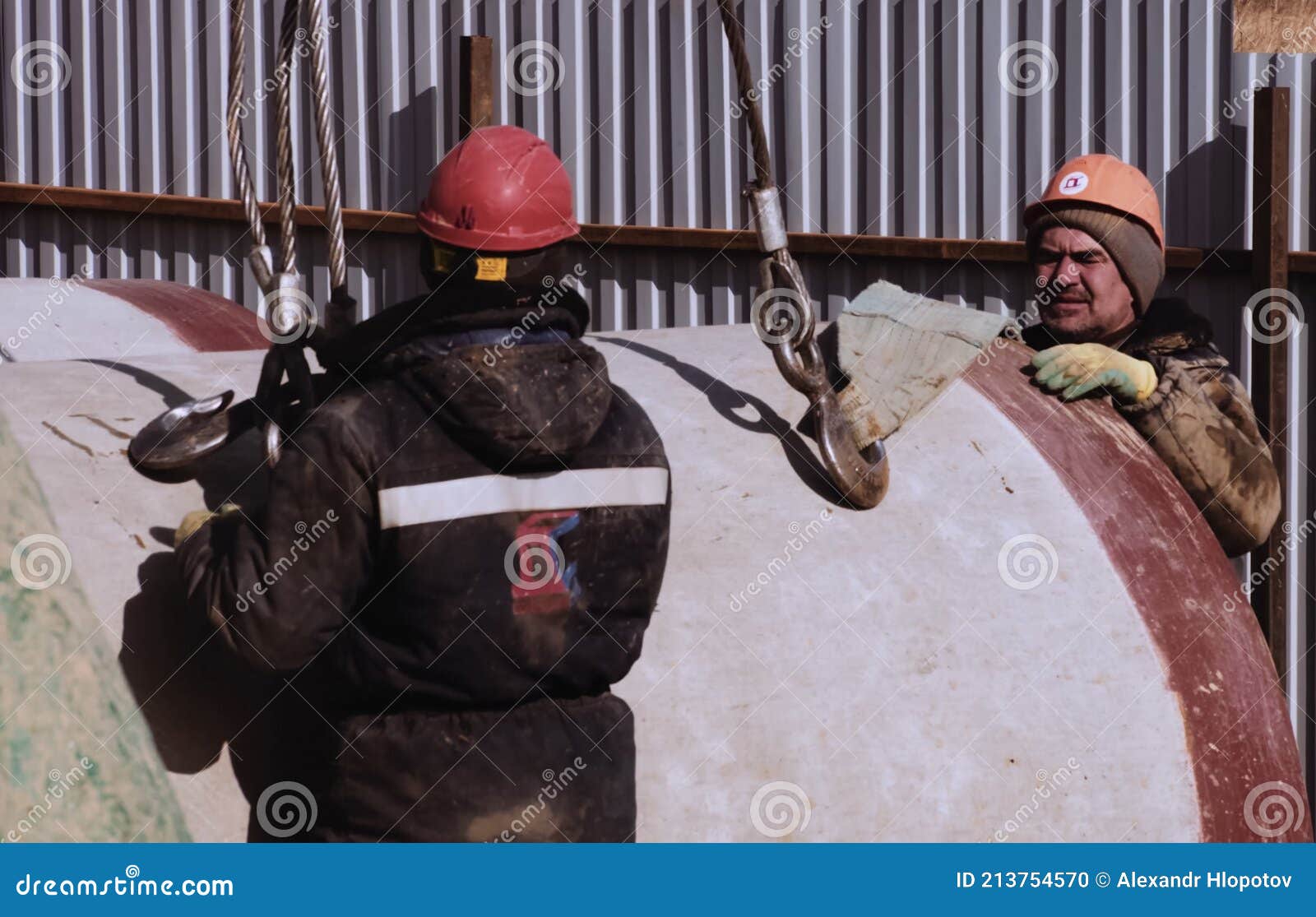 Slinger at Work. Stroply Cargo. Worker in a Helmet Editorial Image ...