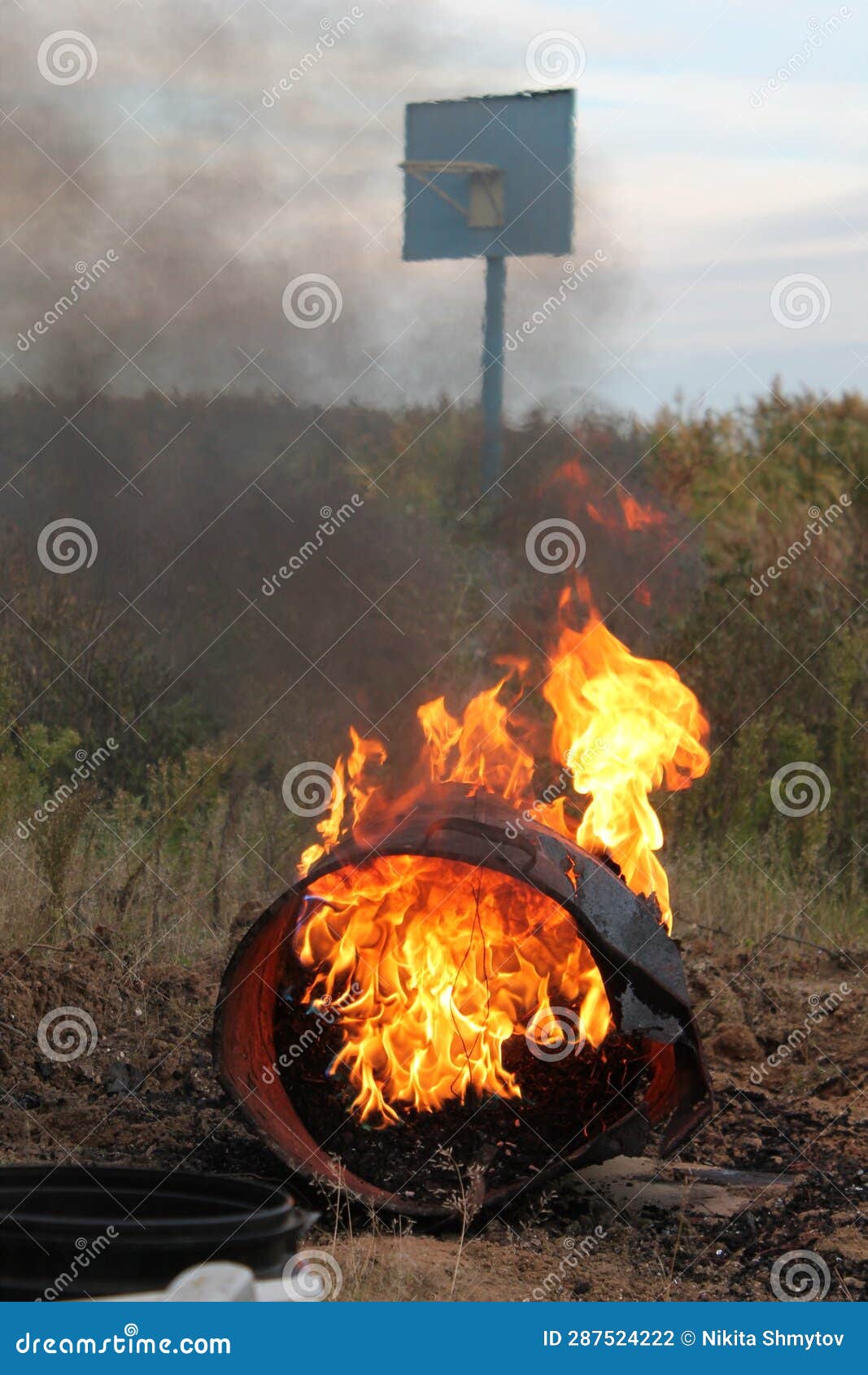 Iron Barrel on Fire in Nature Stock Photo - Image of flame, person ...