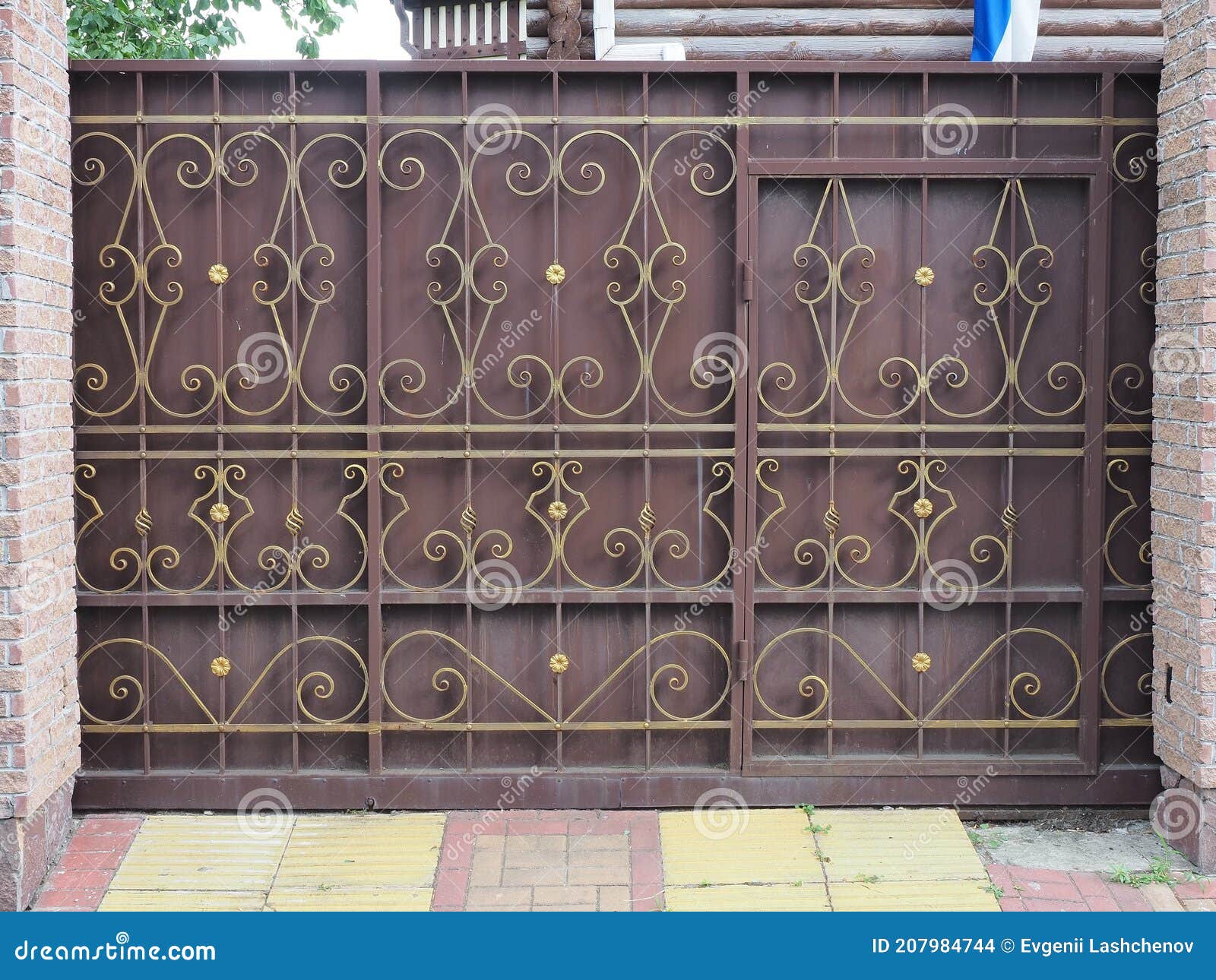 Iron Brown Fence with a Wrought Iron Gilded Pattern Stock Photo - Image ...