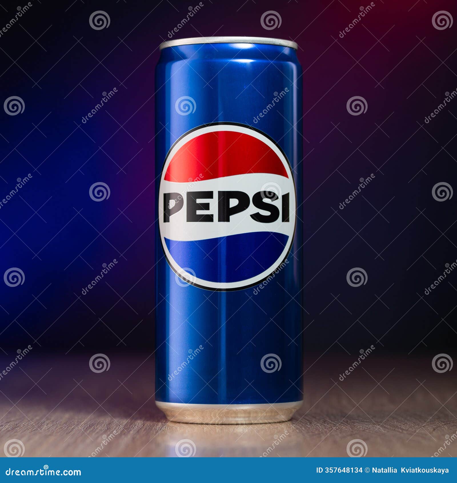 Iron Can of Cola on Table in Blurred Red and Blue Photo. Coke ...