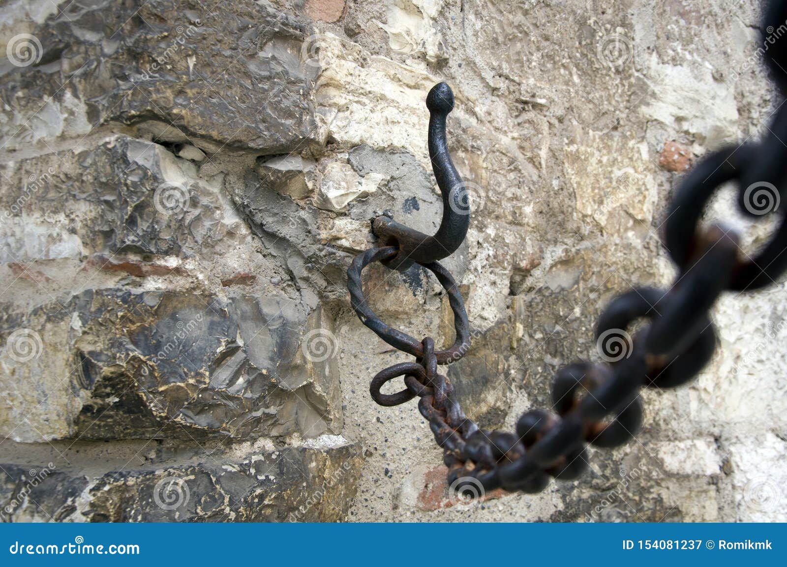 Iron Chain with a Hook on the Wall of an Ancient Castle in Italy Stock ...
