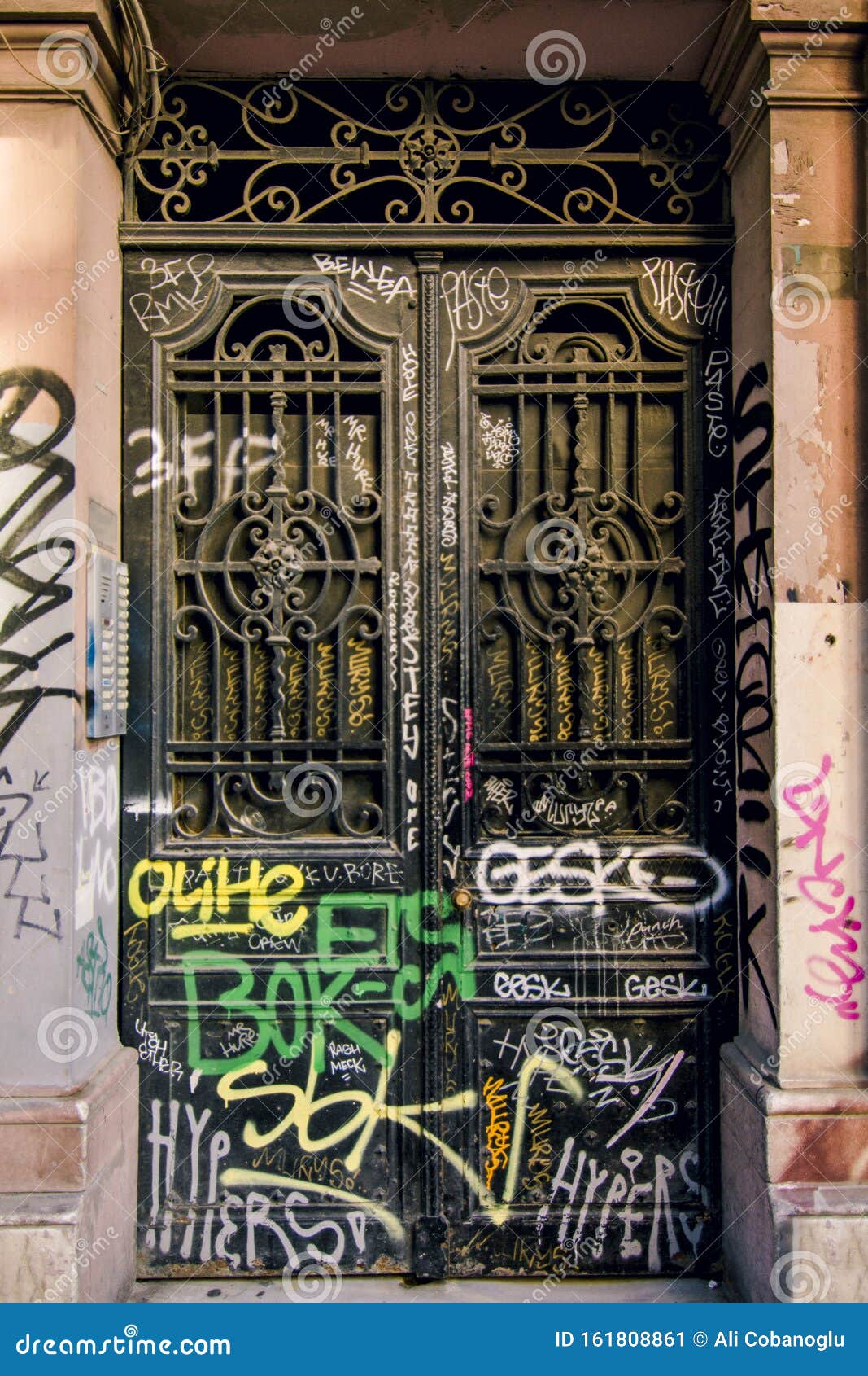 Iron Door Painted Black with Graffiti and Wrought Iron Editorial Photo ...