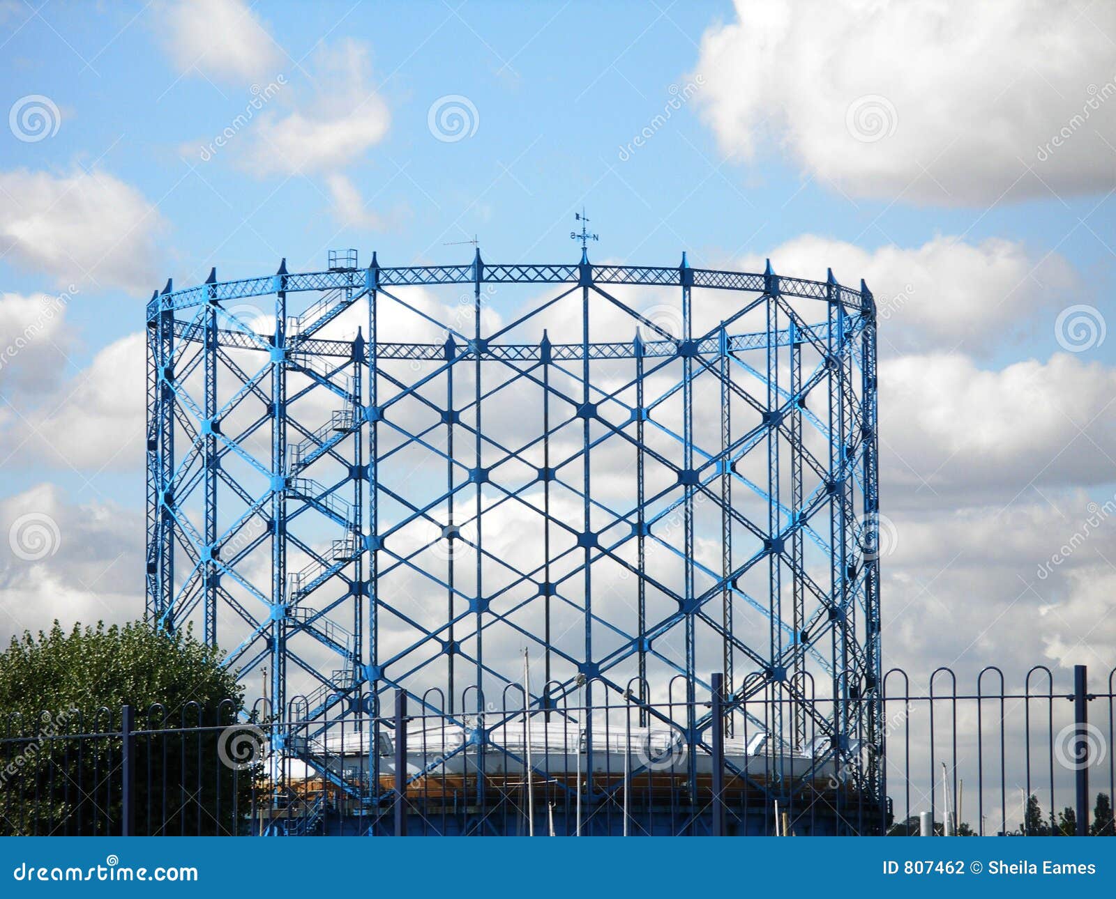 Iron Gas Holder stock photo. Image of fence, clouds, tank - 807462