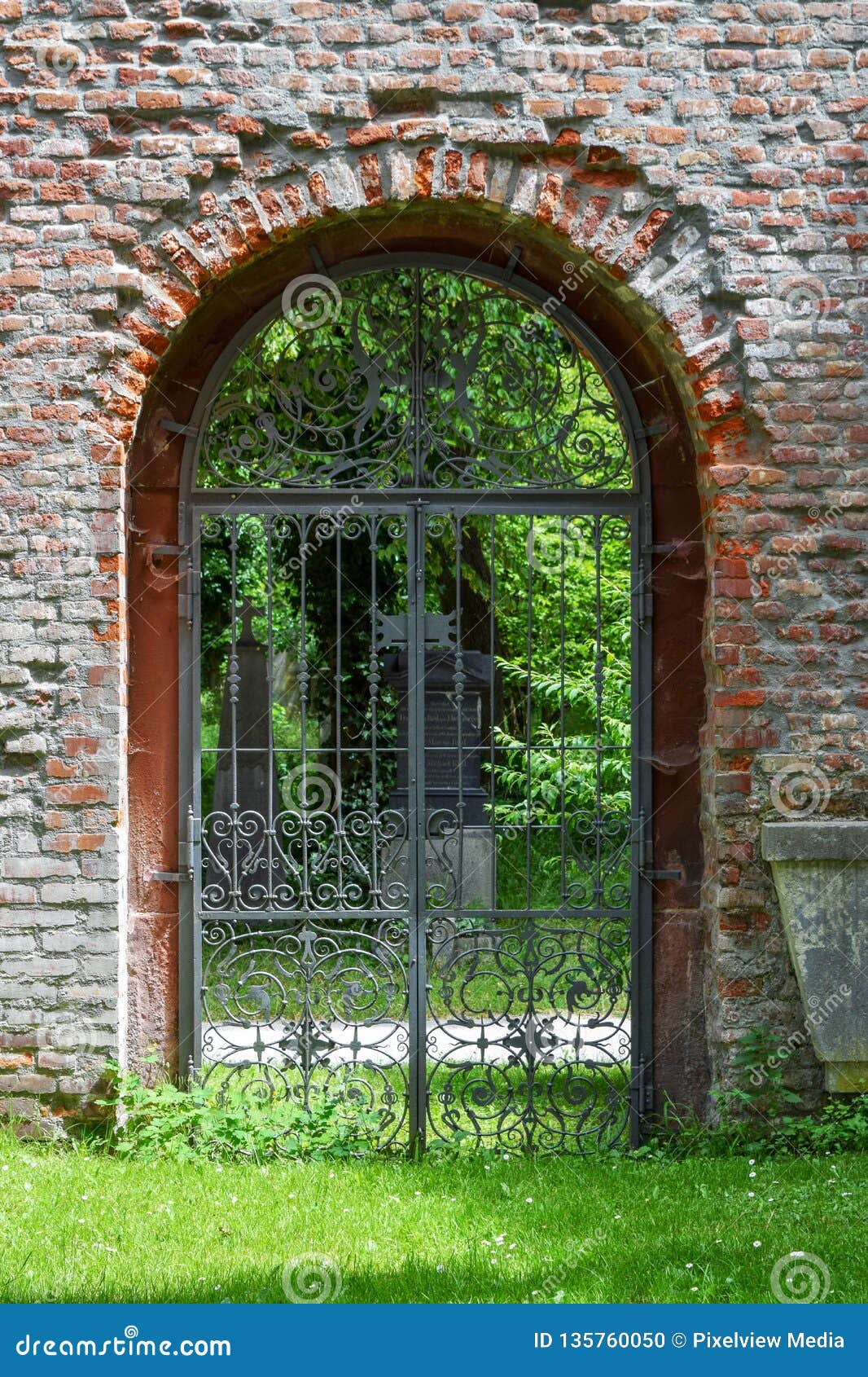 Iron gate in brick wall stock photo. Image of brick - 135760050