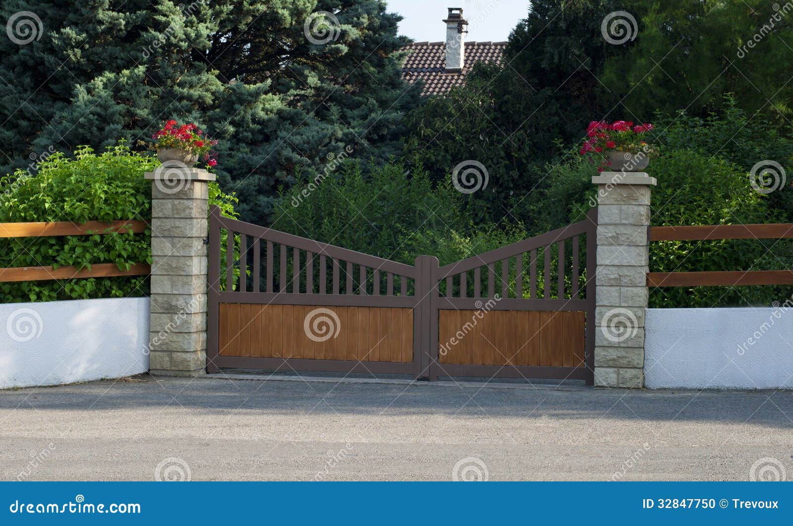 A Gate At The Entrance Of A Village Has A Red And White Flag Umbul ...