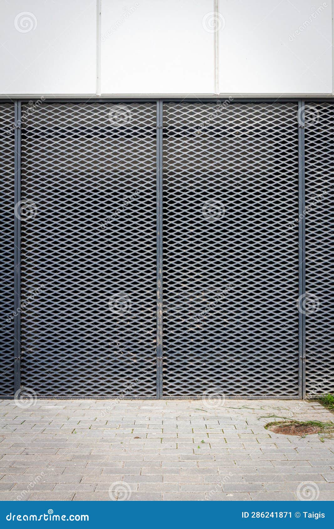 Iron Grid Wall and a Sidewalk Stock Image - Image of building, gray ...