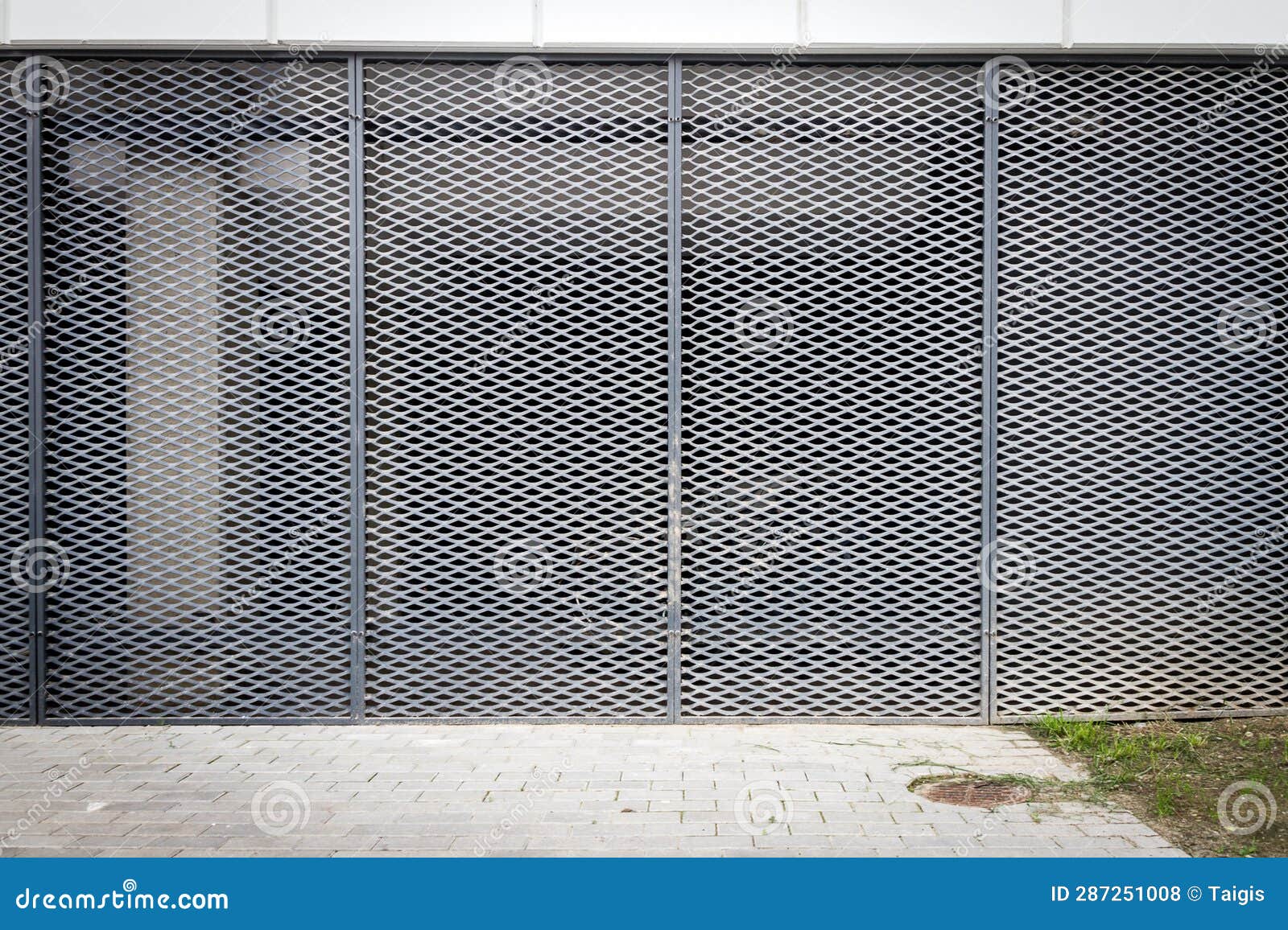Iron Grid Wall and a Sidewalk Stock Photo - Image of street ...