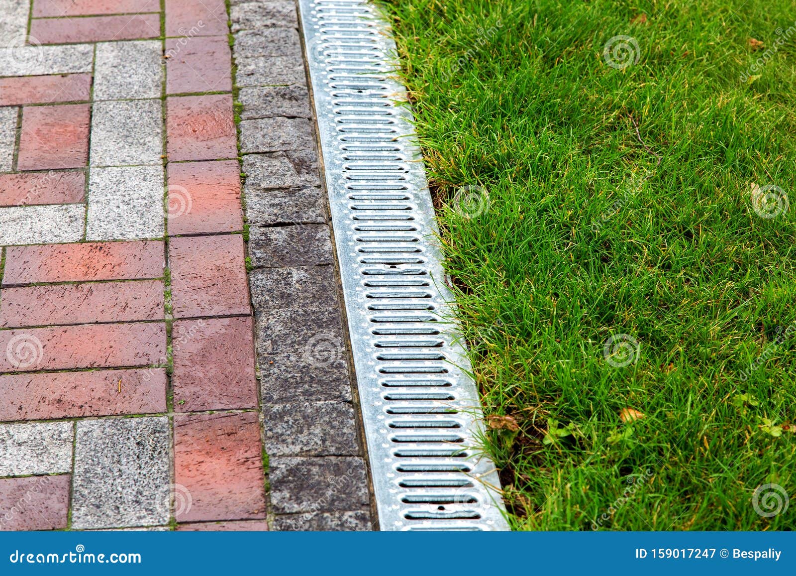 An Iron Gutter with Grate To the Drainage System. Stock Image - Image ...