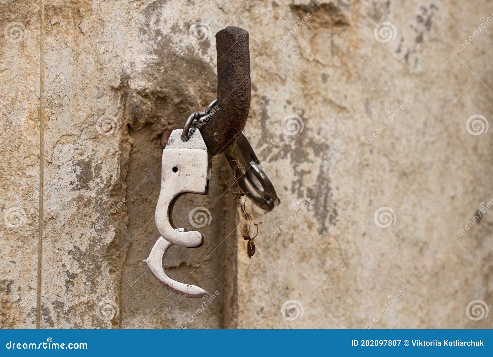 Iron Handcuffs Hanging on a Hook on the Wall of the House Close Up ...
