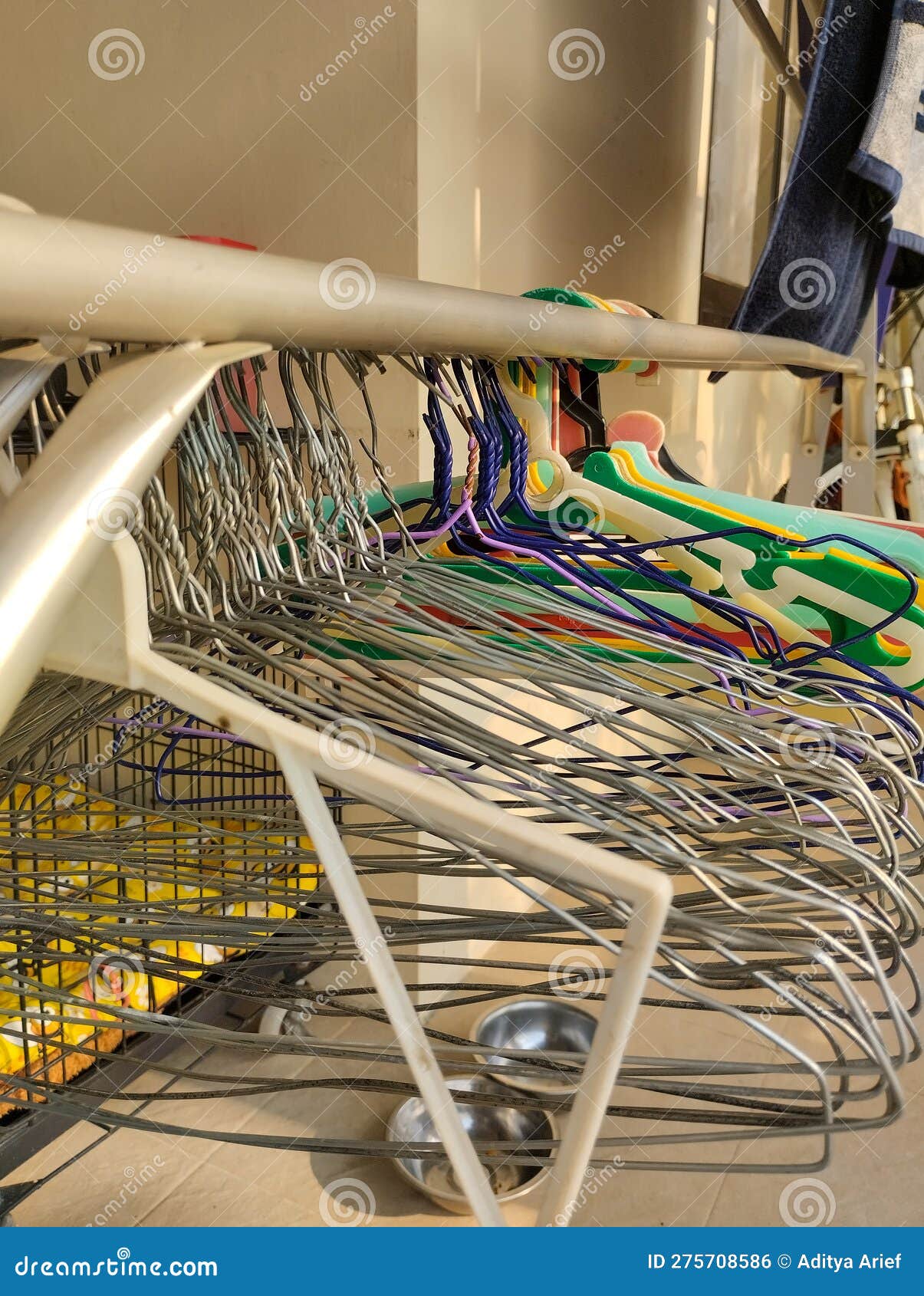 Iron Hangers and Colored Plastic Hangers are Hung on Stainless ...