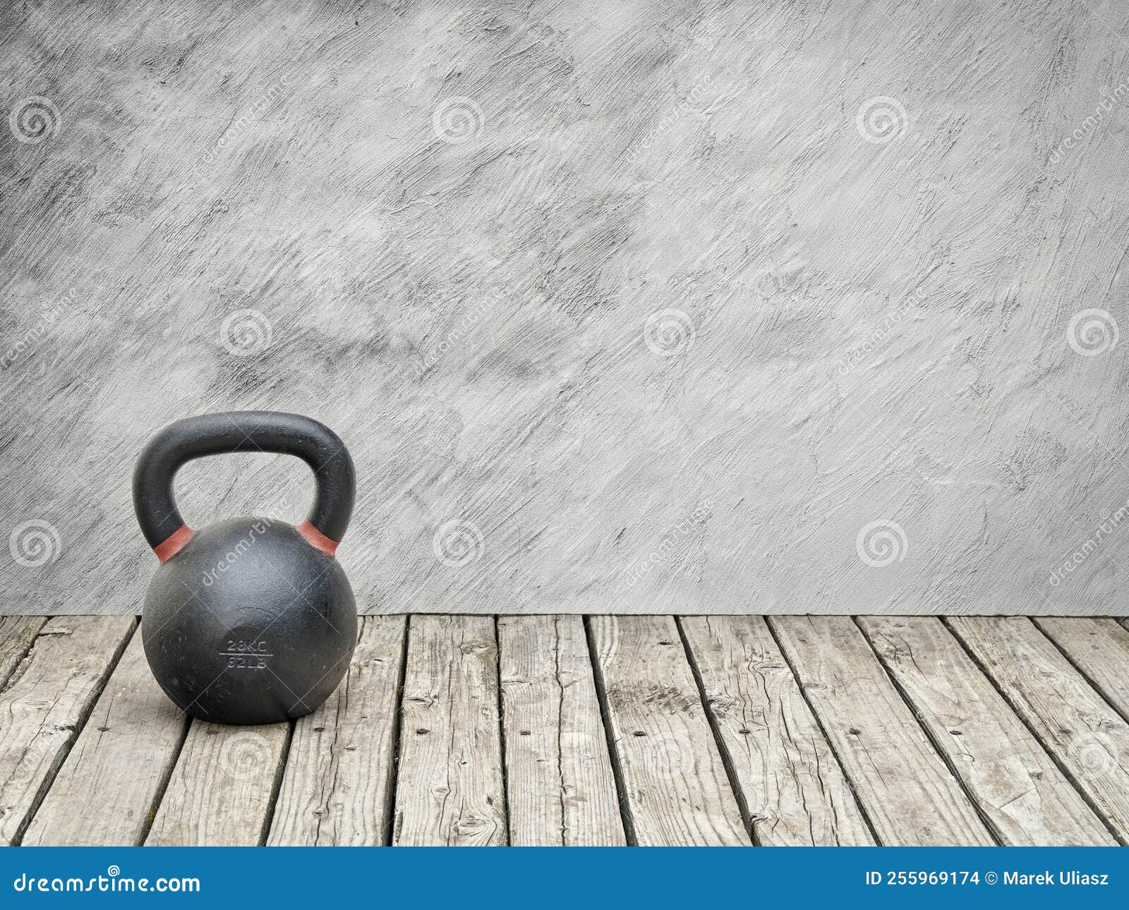Iron Kettlebell on a Rustic Wood Stock Photo - Image of wall, concrete ...
