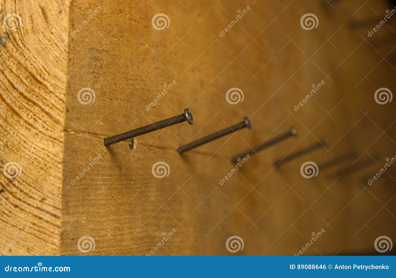 An Iron Nail is Driven into the Board. Background Stock Photo - Image ...