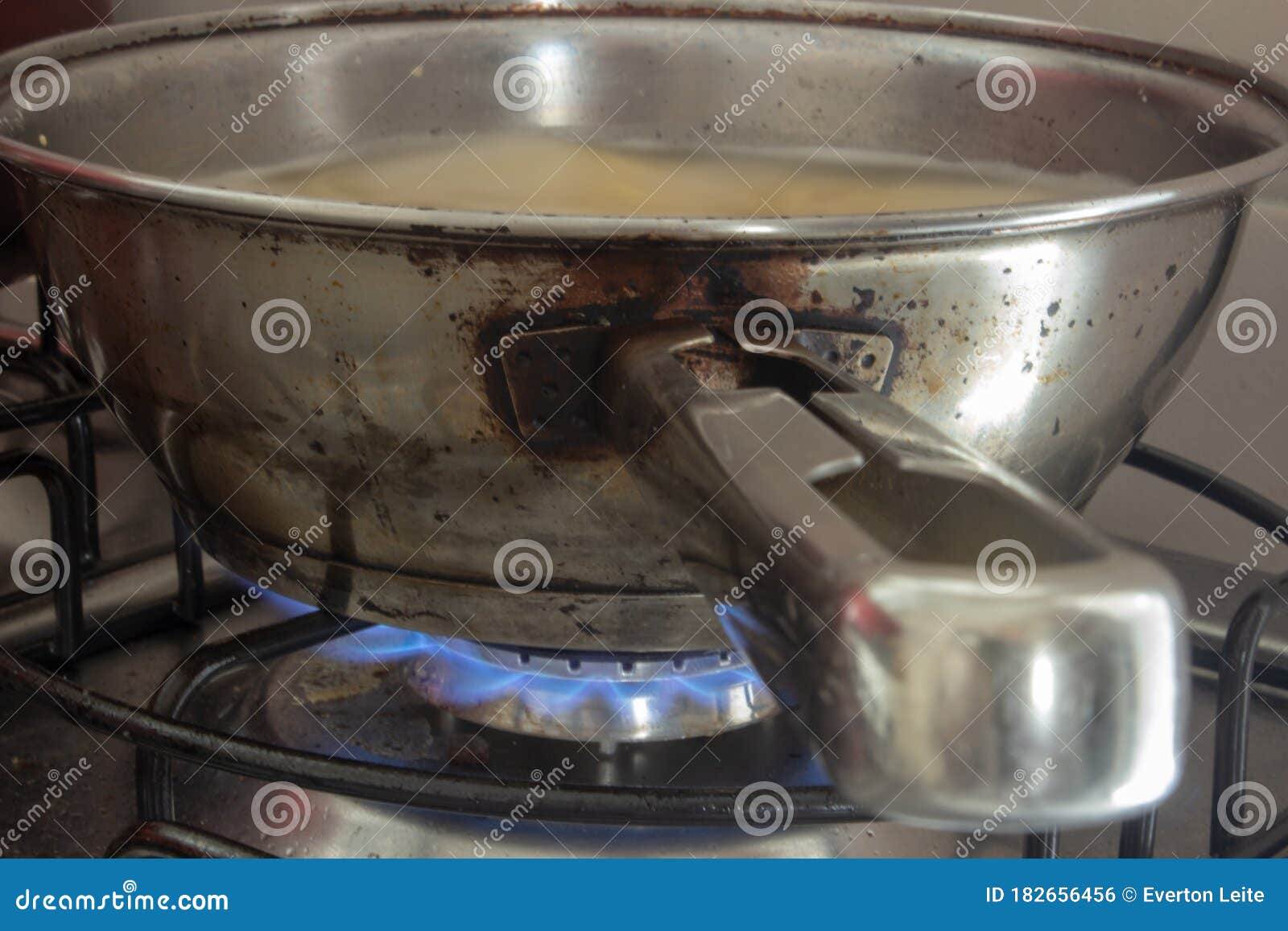 Iron Pan Boiling Some Water with Pasta on a Stove with the Fire on ...