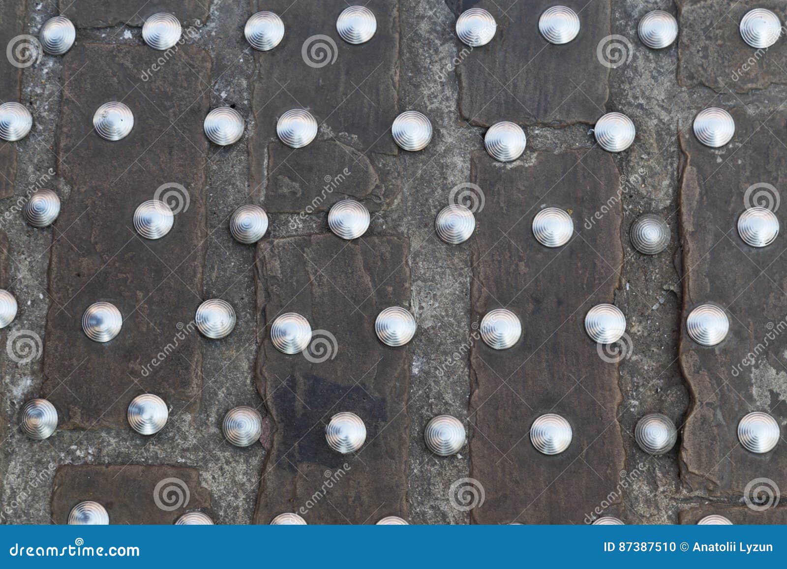 Iron Rivets on the Stone Cobbles Stock Photo - Image of shiny, pavement ...