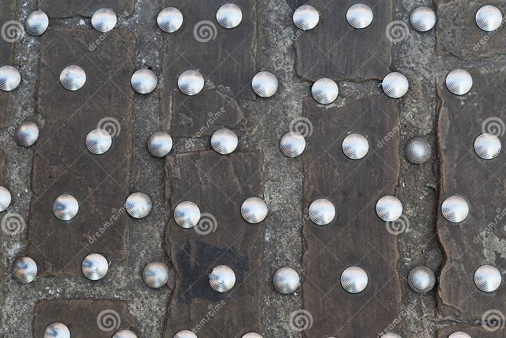 Iron Rivets on the Stone Cobbles Stock Photo - Image of shiny, pavement ...