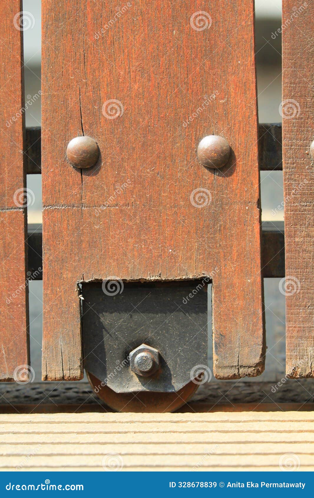 An Iron Roller Wheel on a Wooden Sliding Gate. Stock Image - Image of ...