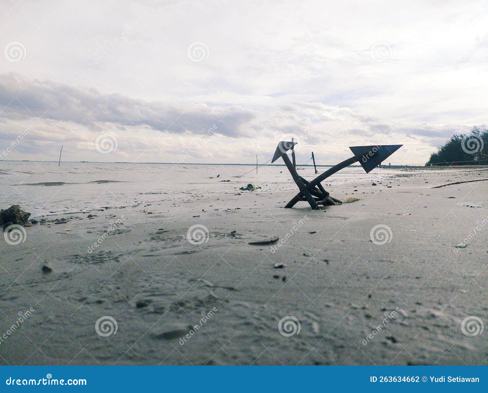An Iron Ship Anchor on the Beach Stock Photo - Image of anchor, wind ...