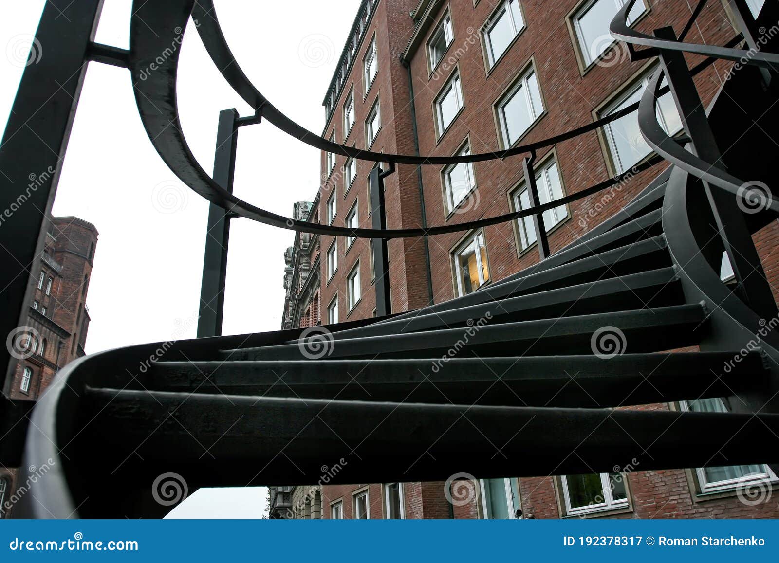 Iron Spiral Staircase Bottom View on the Background of a Building Stock ...