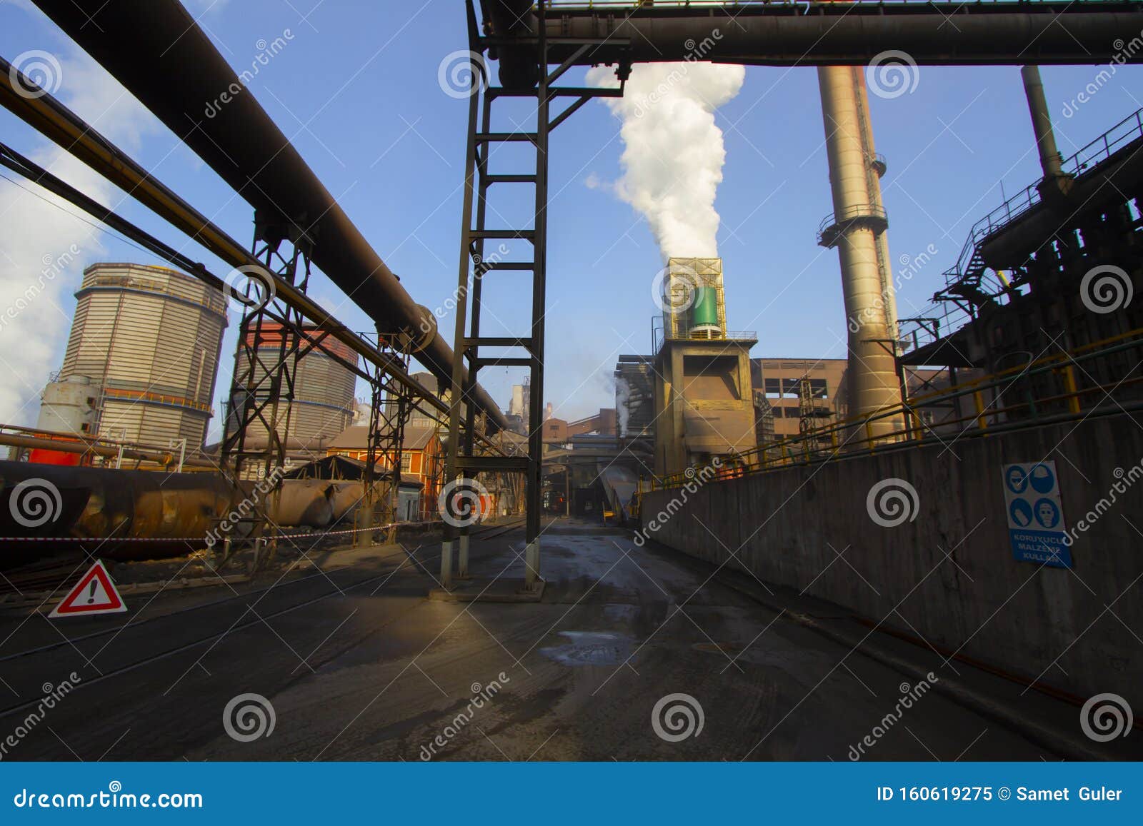 Iron and Steel Producing Factory and Workers Working. Stock Image ...