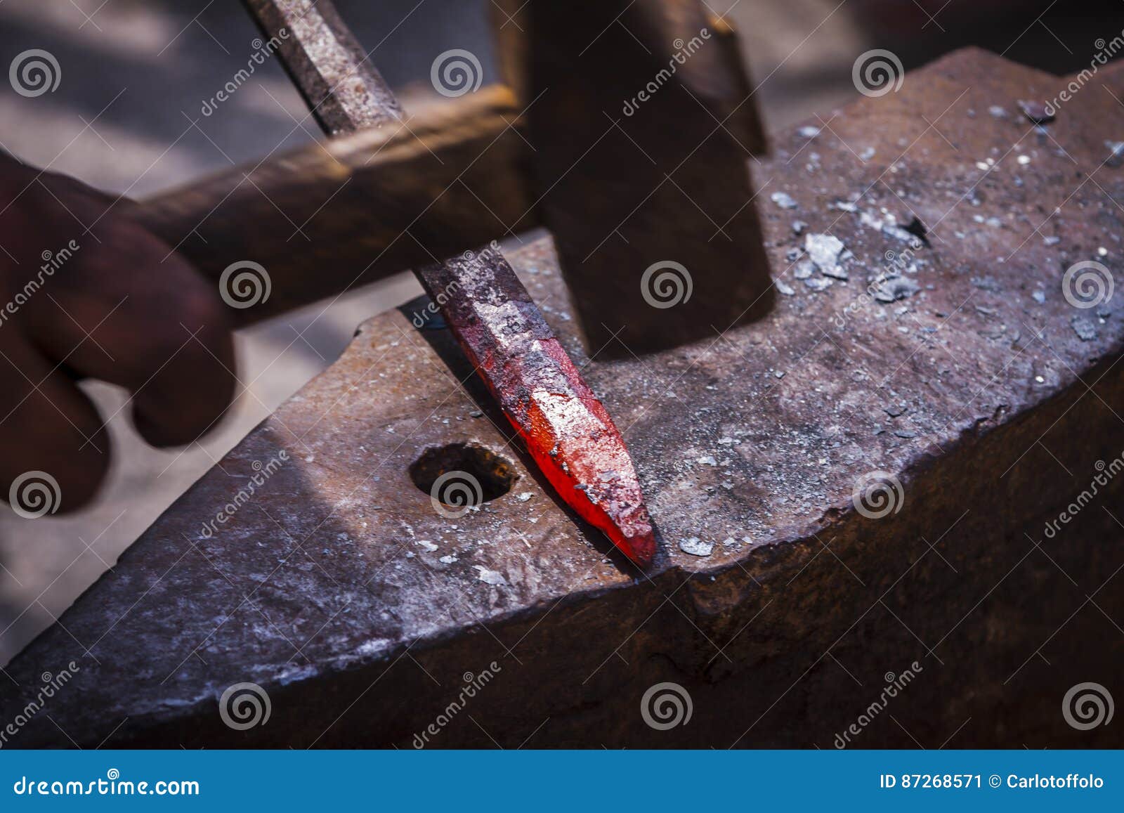 Iron tool is being forged stock image. Image of heated - 87268571