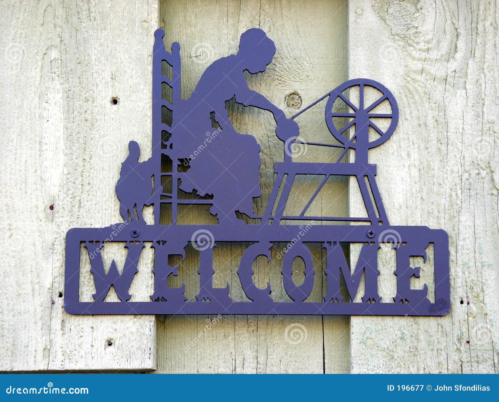 Iron Welcome stock image. Image of woman, wheel, iron, sign - 196677