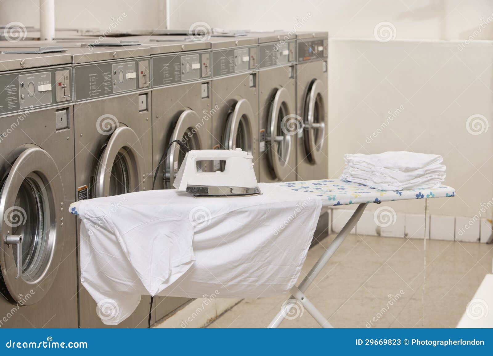 Ironing Board with Washing Machines in Laundromat Stock Image - Image ...