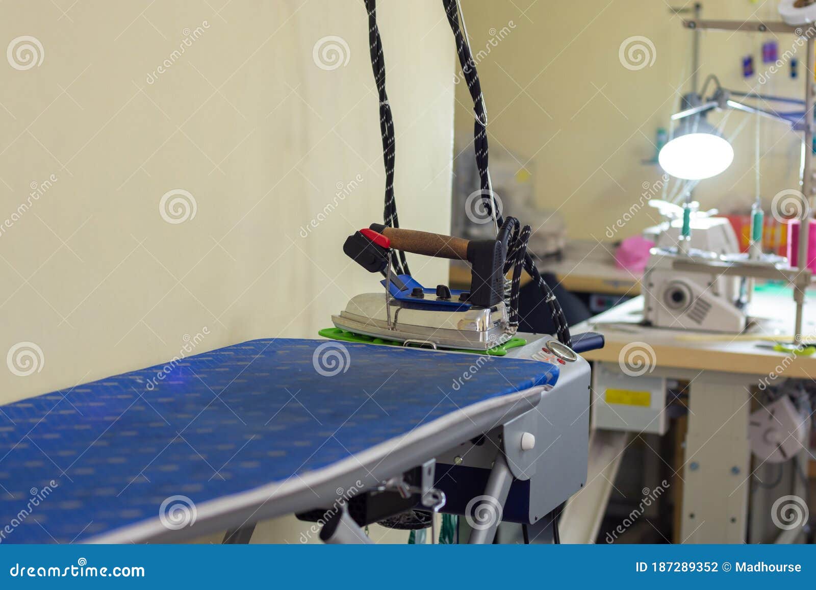 Ironing Machine with Iron in Sewing Workshop Stock Photo - Image of ...