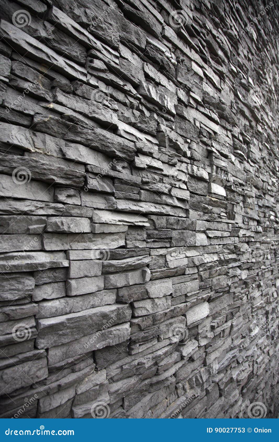Irregular Shaped Stone Wall with Different Levels Stock Image - Image ...
