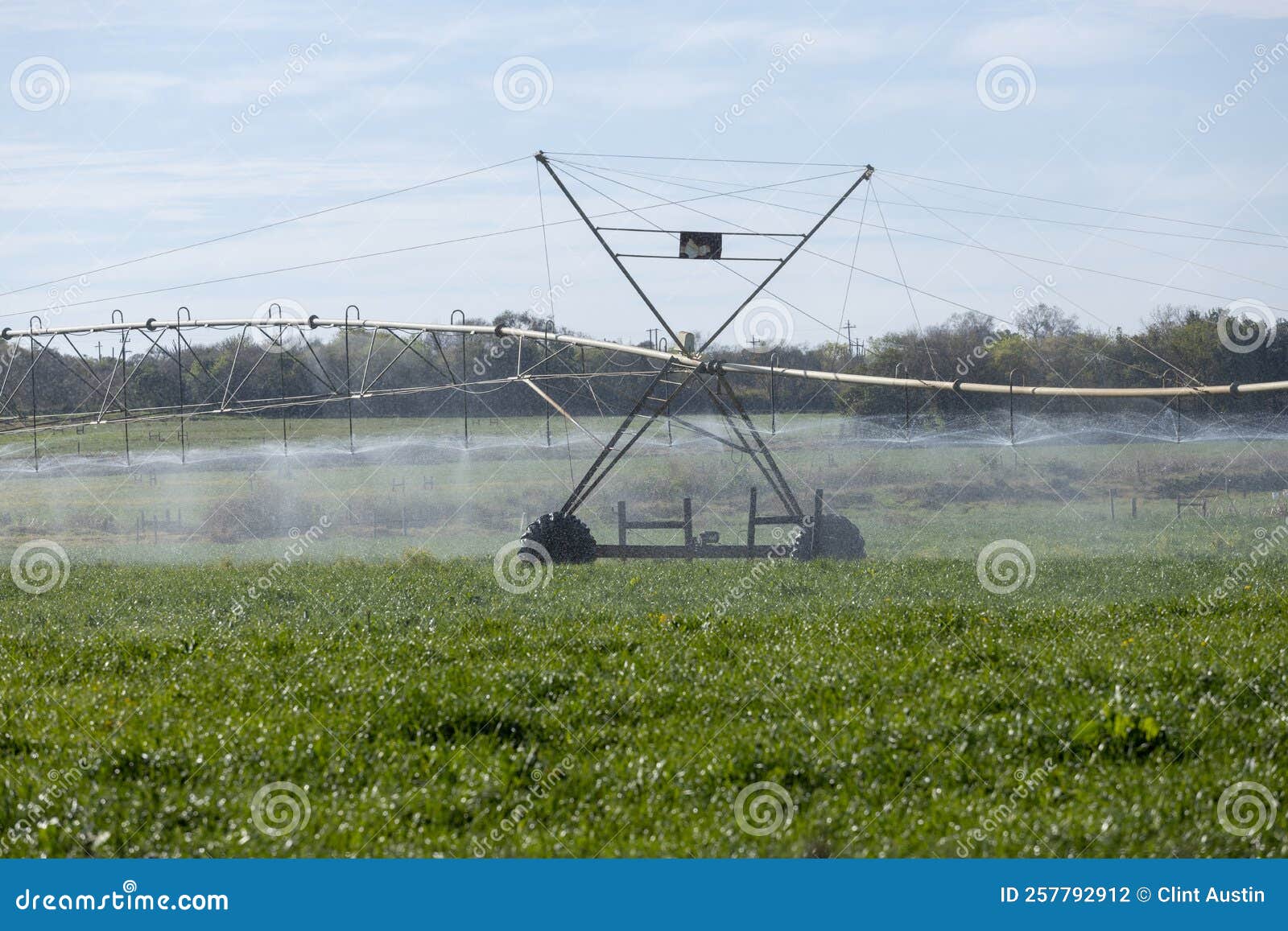 An Irrigation Pivot Watering a Field of Crops Stock Photo - Image of ...