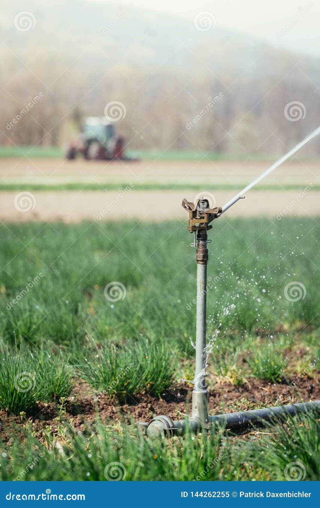 Irrigation Plant System on a Field, Agriculture. Tractor in the Blurry ...
