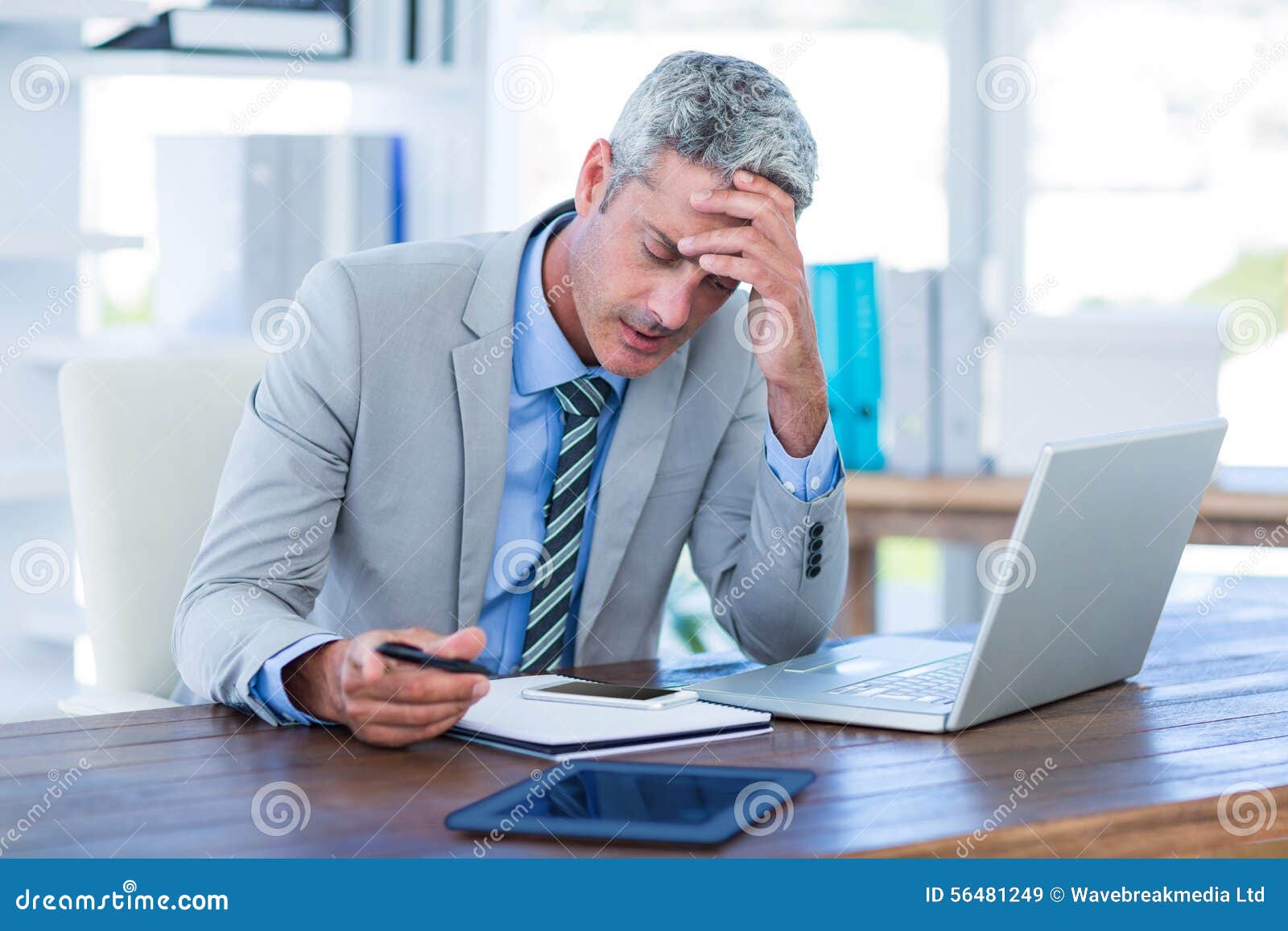 Irritated Businessman Trying To Work Stock Image - Image of irritated ...