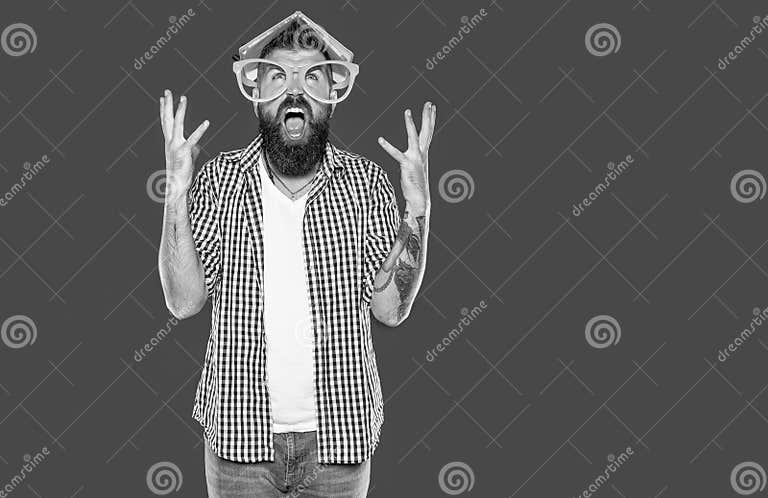 Irritated Funny Bearded Man In Party Glasses With Book On Head Stock