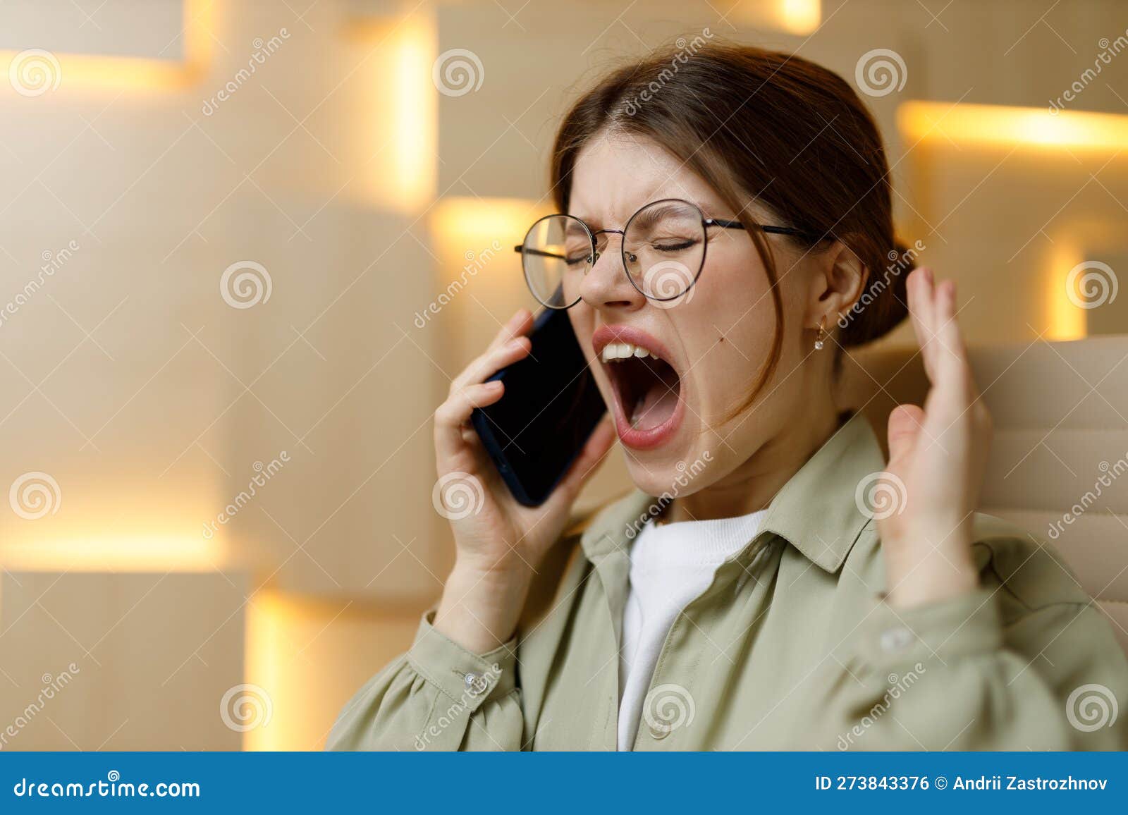 Irritated Young Woman Screaming into the Phone Stock Photo - Image of ...