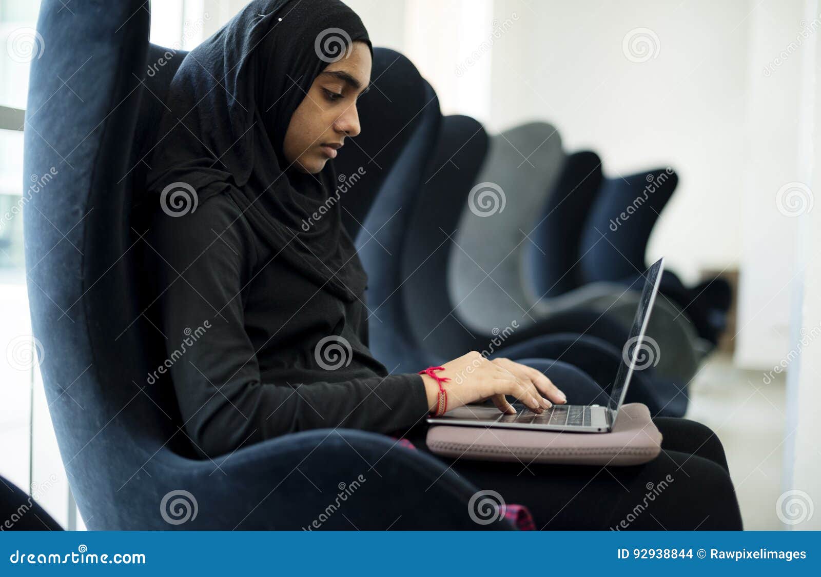 Islamic Girl Sitting and Using Laptop Stock Photo - Image of device ...