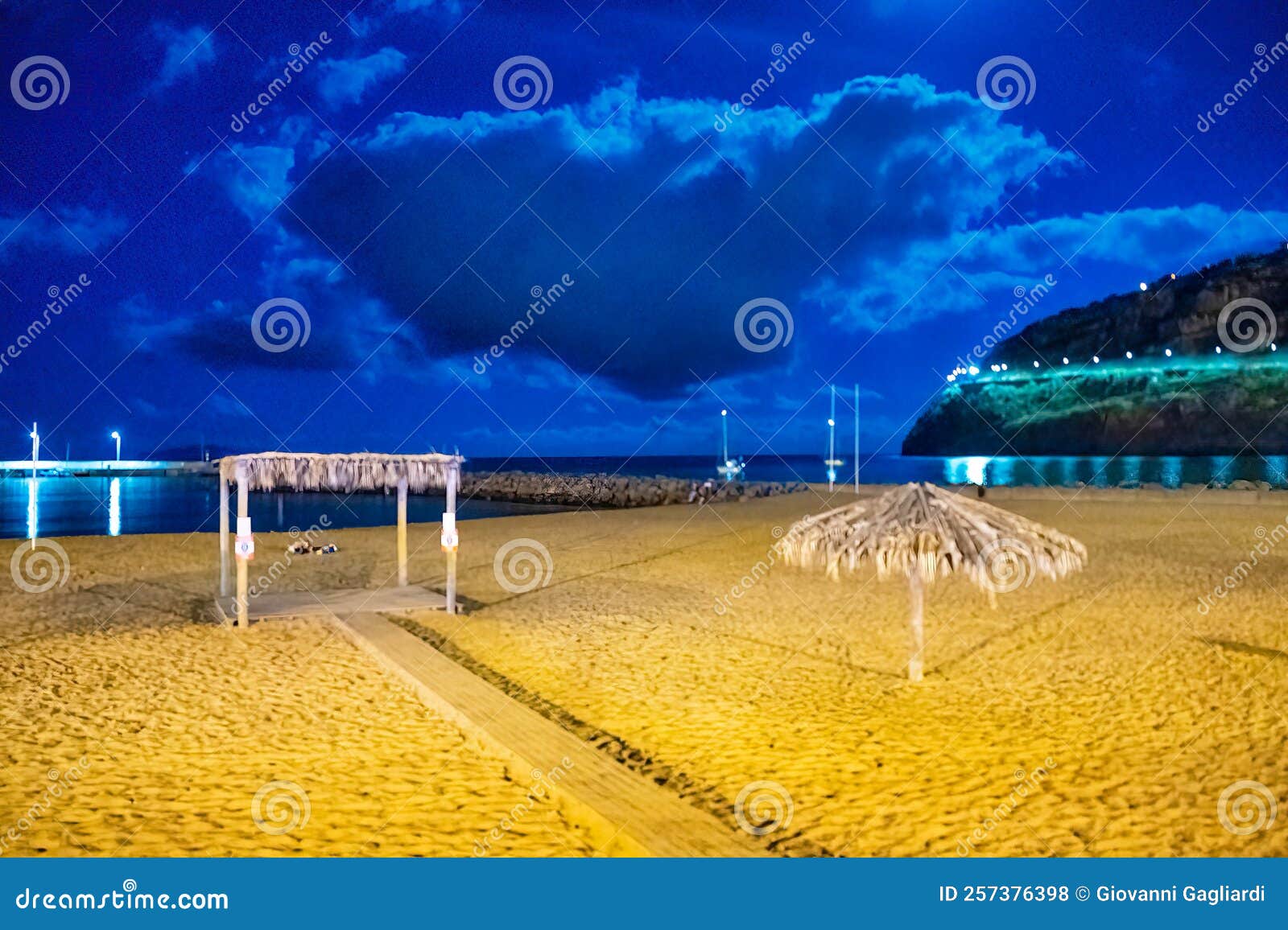 Island Beach at Night, Straw Umbrella on the Sand Stock Photo - Image ...