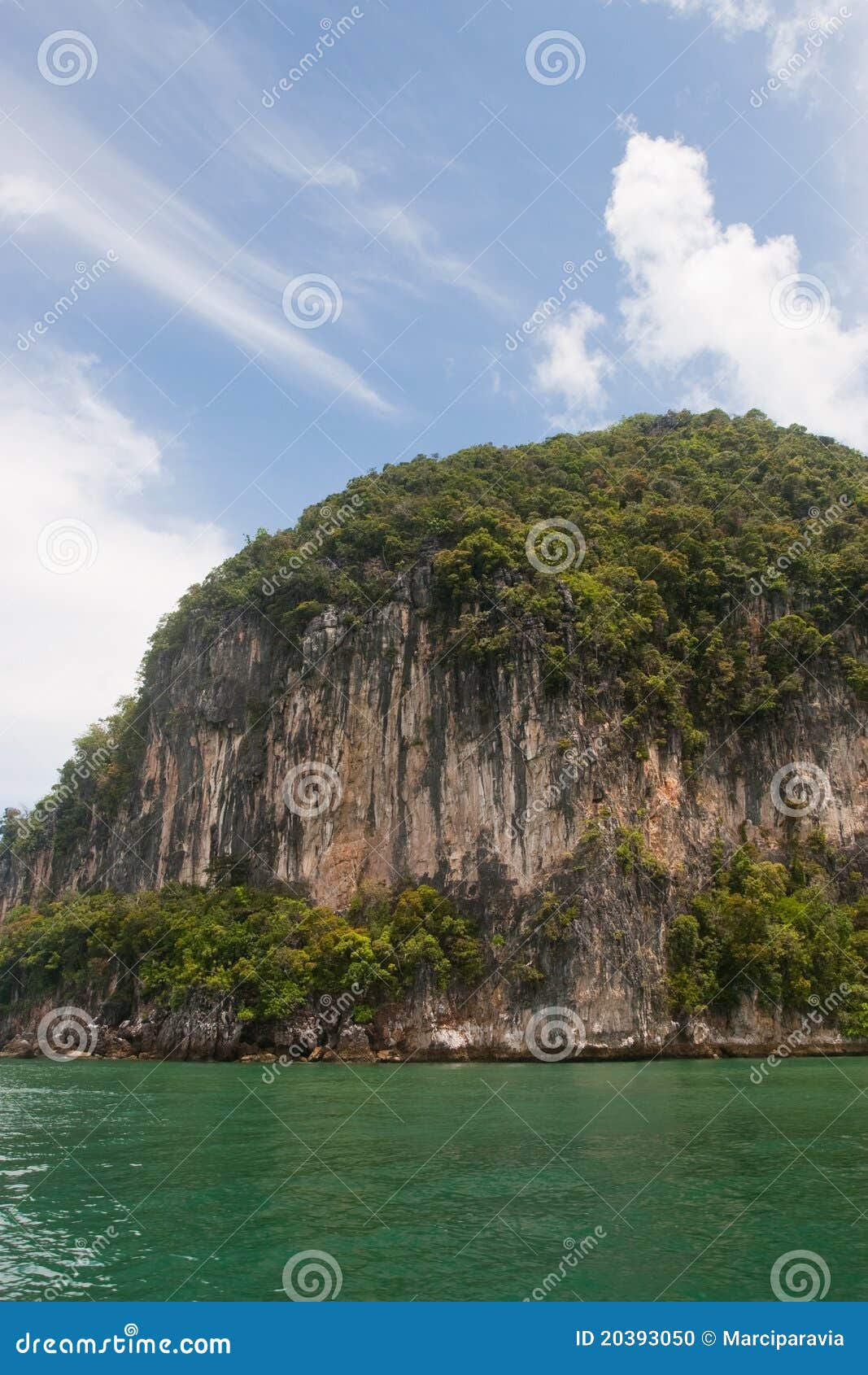Island cliff stock photo. Image of rock, clouds, leaves - 20393050